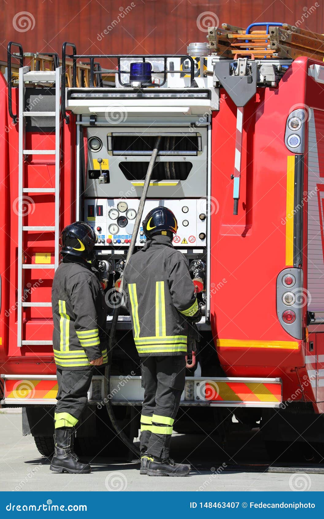 Two Firemen in Action during Fire Drill Stock Image - Image of ...