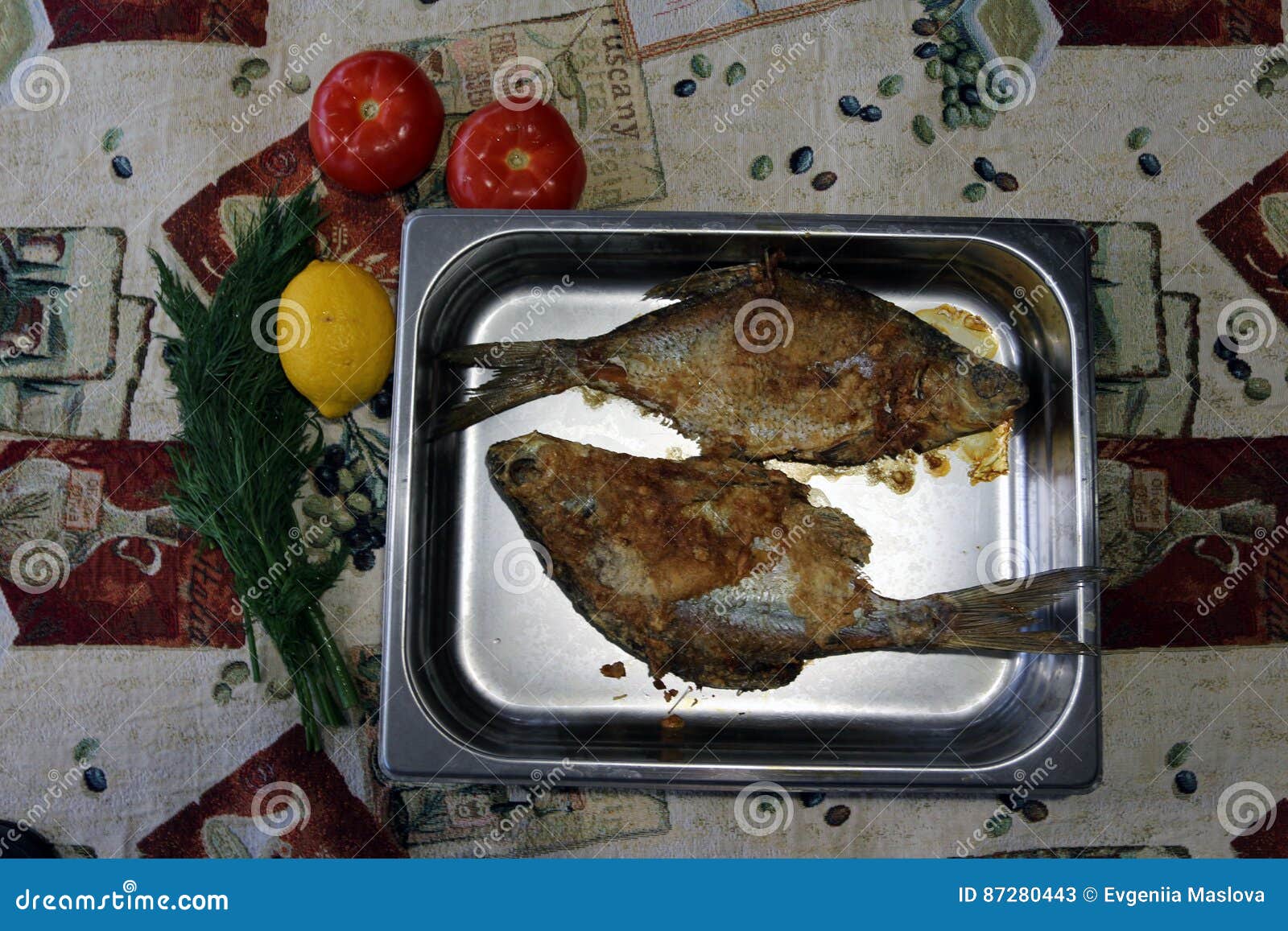 Two fish baked in the oven stock image. Image of tomato - 87280443