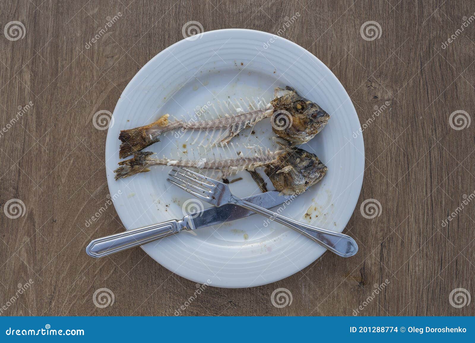 Fishbone With Fork And Knife In A Beautiful Plate Royalty-Free Stock ...