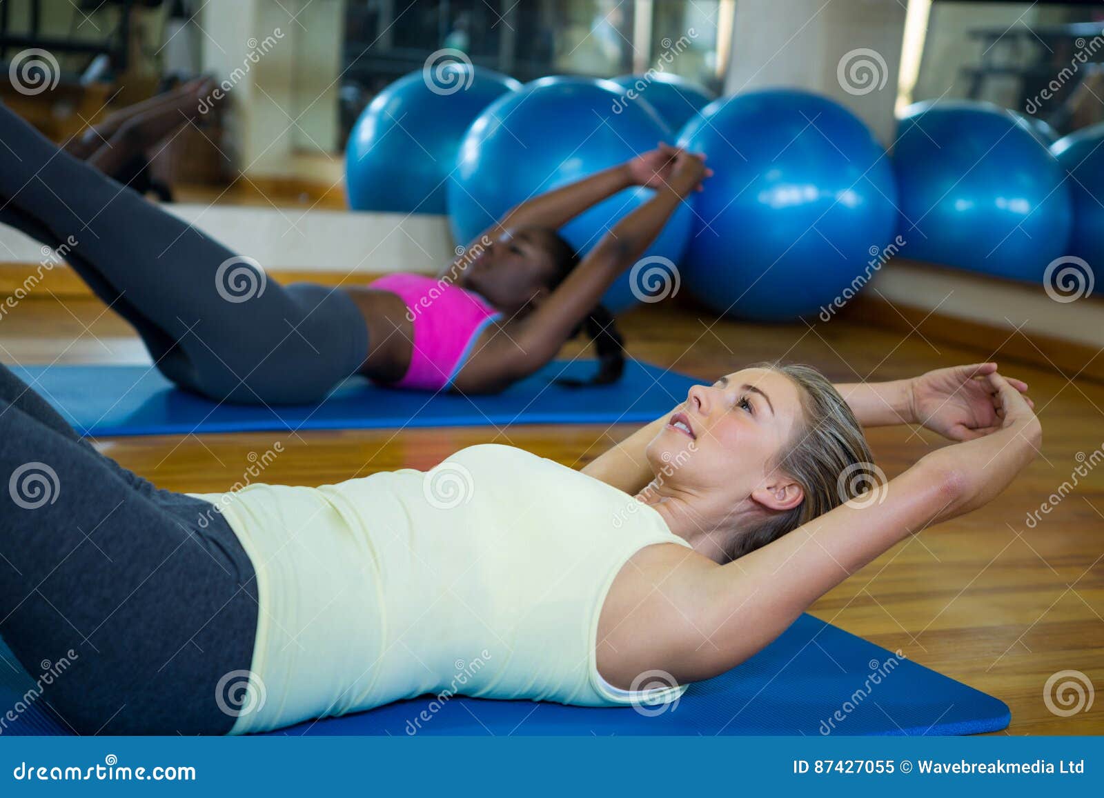 Two Fit Women Doing Stretching Exercise On Mat Stock Image Image Of