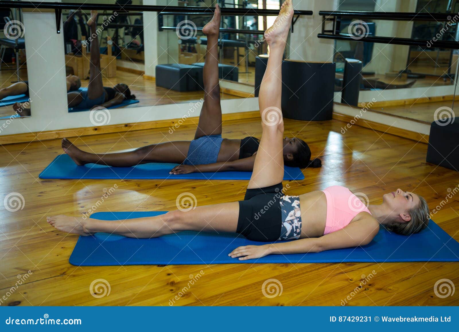 Two Fit Women Doing Stretching Exercise On Mat Stock Image Image Of