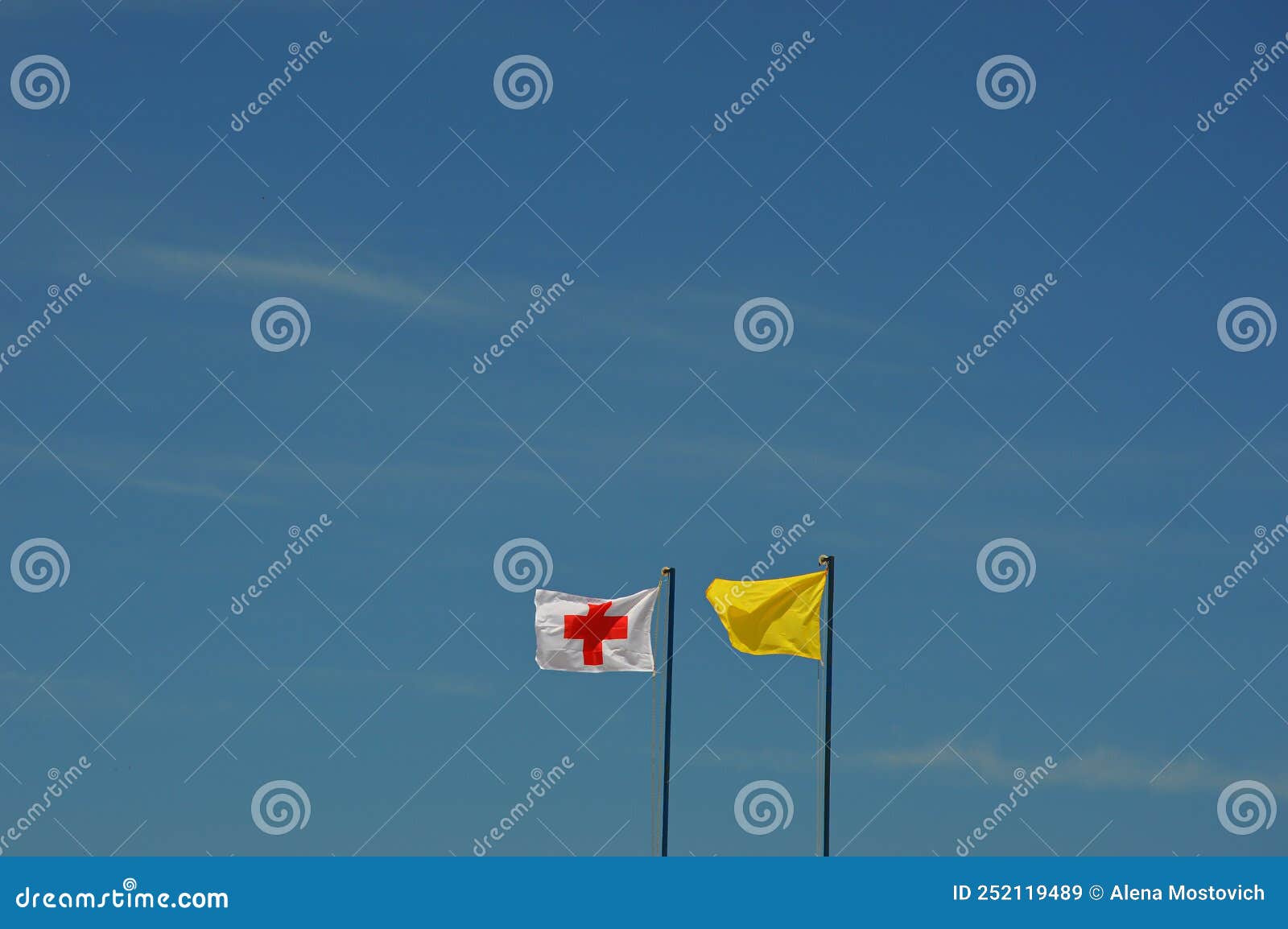Two Flags Over the Sea, a Yellow and a Medical Flag Against the Sky ...