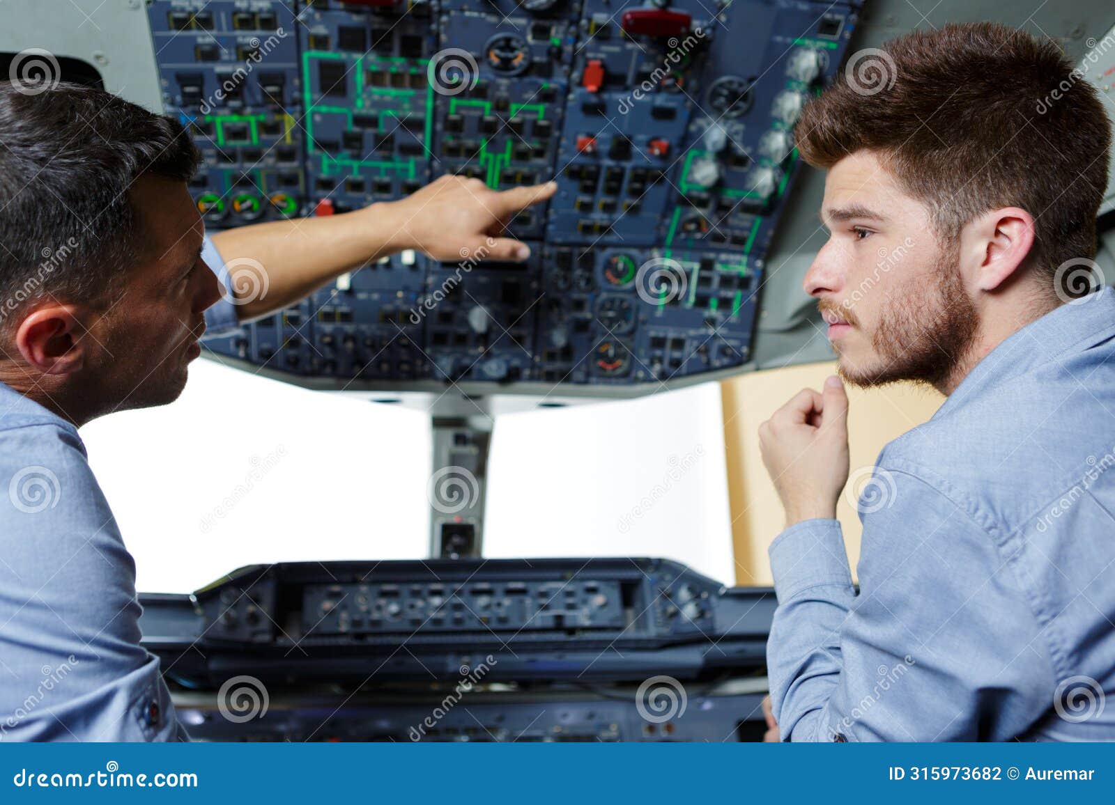 Two Flight Engineers Talking in Cockpit Stock Photo - Image of flight ...