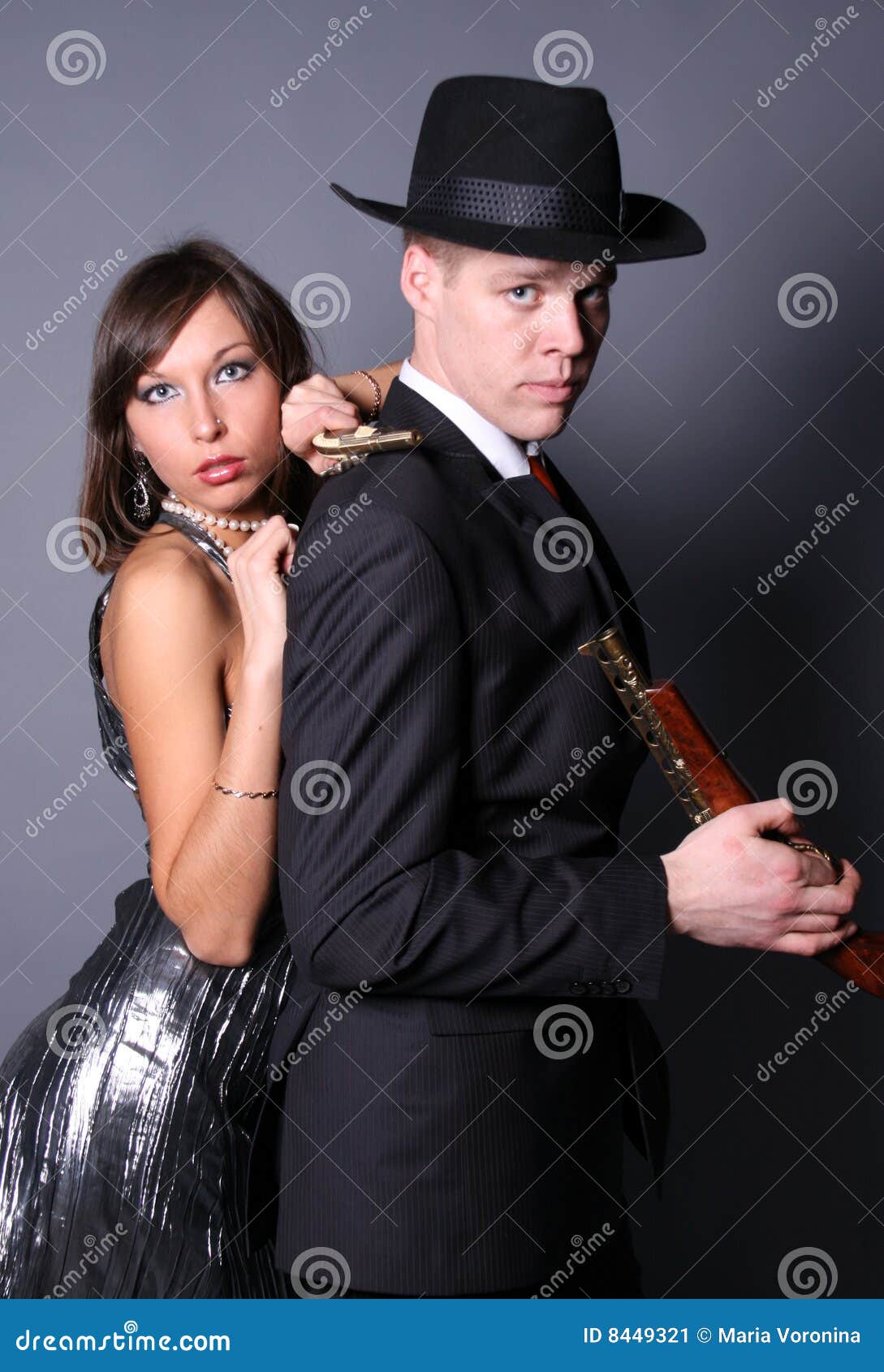 Two flirting gangsters stock image. Image of musket, beads - 8449321