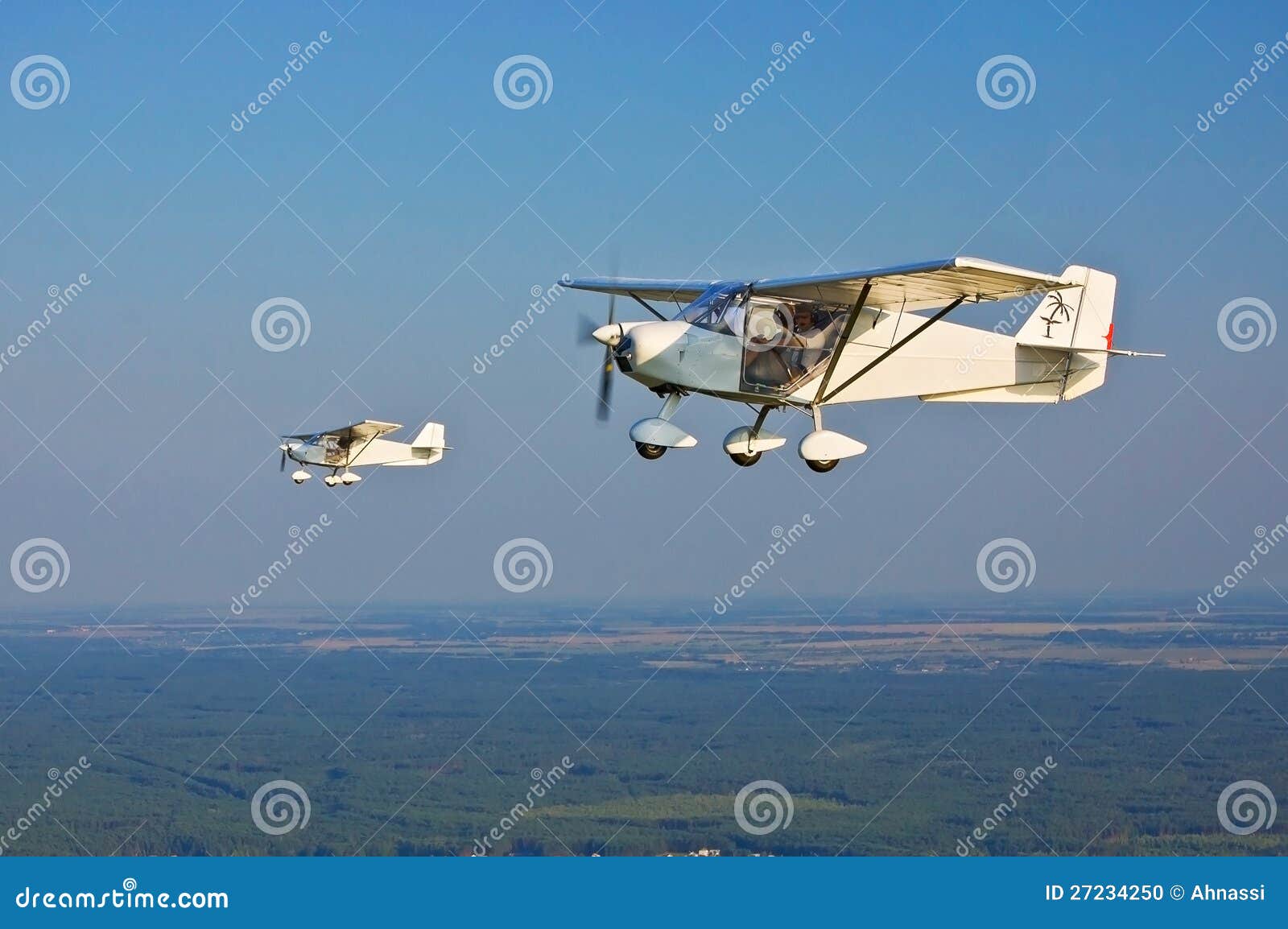 Two Flying Planes stock photo. Image of competition, plane - 27234250
