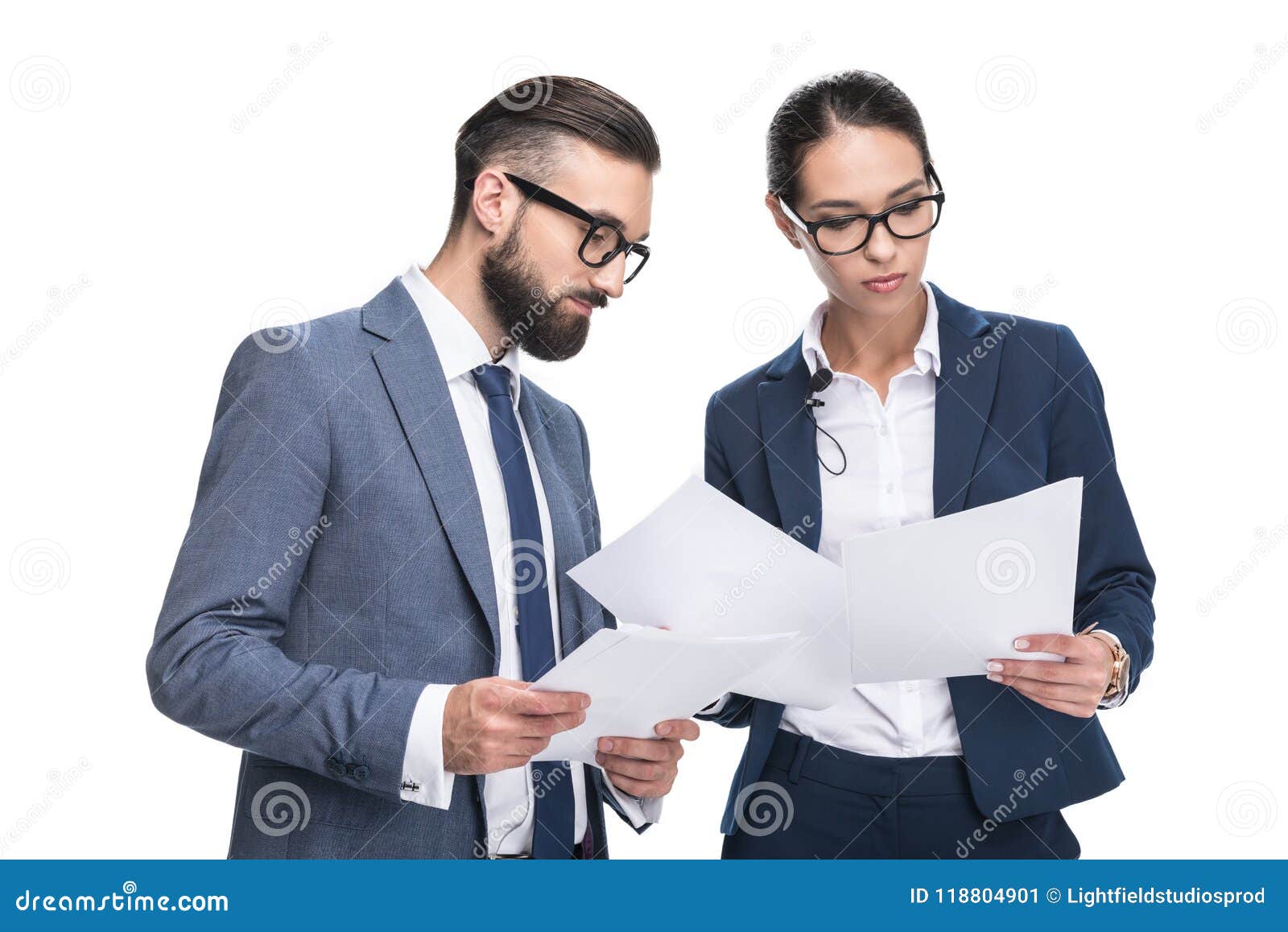 Two Focused Businesspeople in Suits Looking at Papers, Stock Image ... Two Focused Businesspeople in Suits Looking at Papers, Stock Image ...