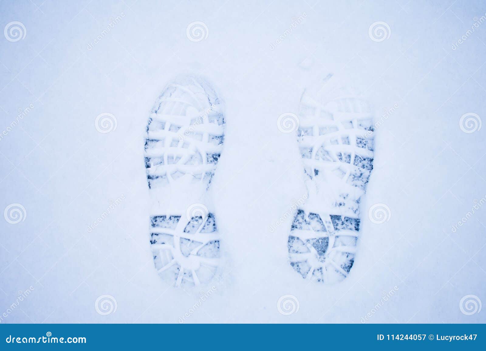 Two Foot Prints in the Snow Stock Image - Image of snow, making: 114244057