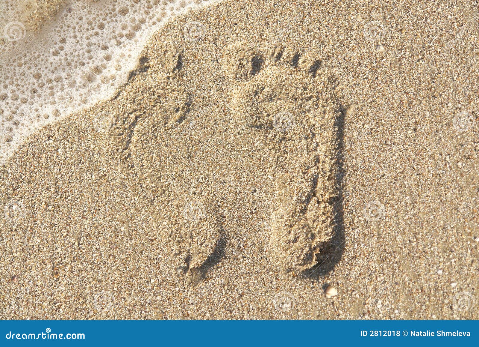 Two Footprints on the Beach Stock Photo - Image of holiday, swimming ...