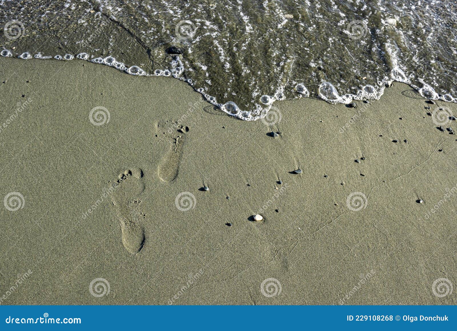 Two Footprints on Beach Sand Stock Photo - Image of vacation, wave ...