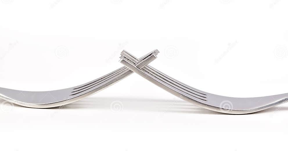 Two Forks Cross on White Surface Stock Photo - Image of crisscross ...