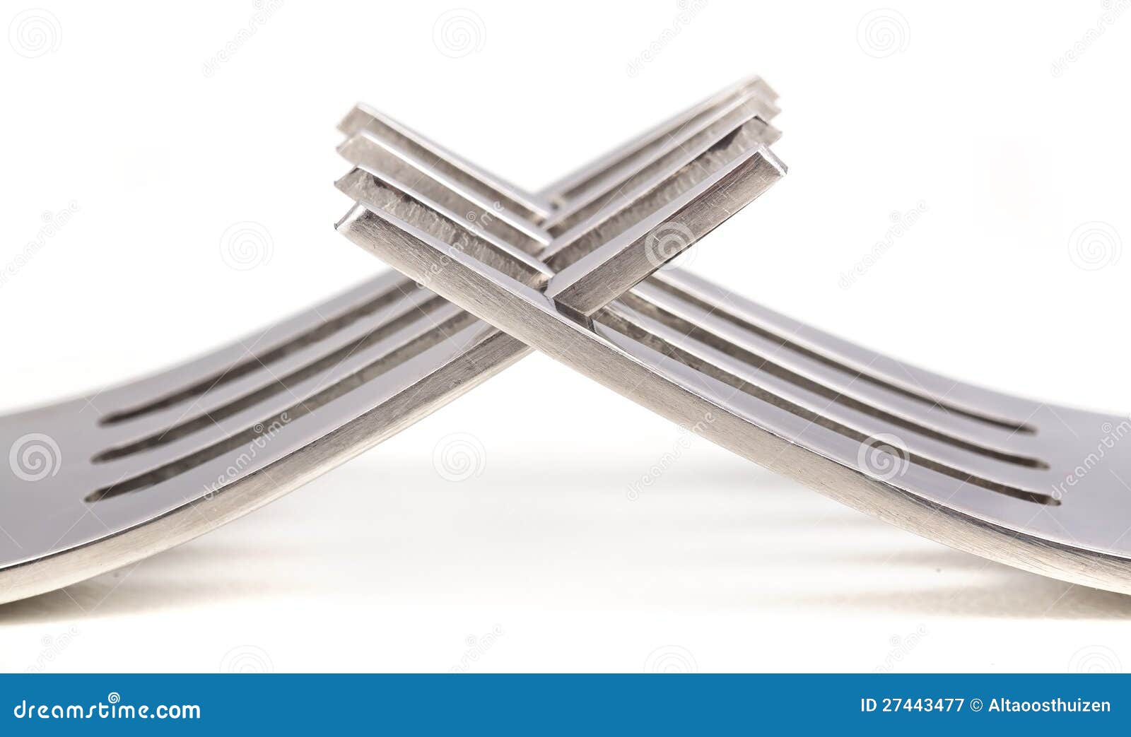 Two Forks Cross on White Surface Stock Image - Image of concept ...