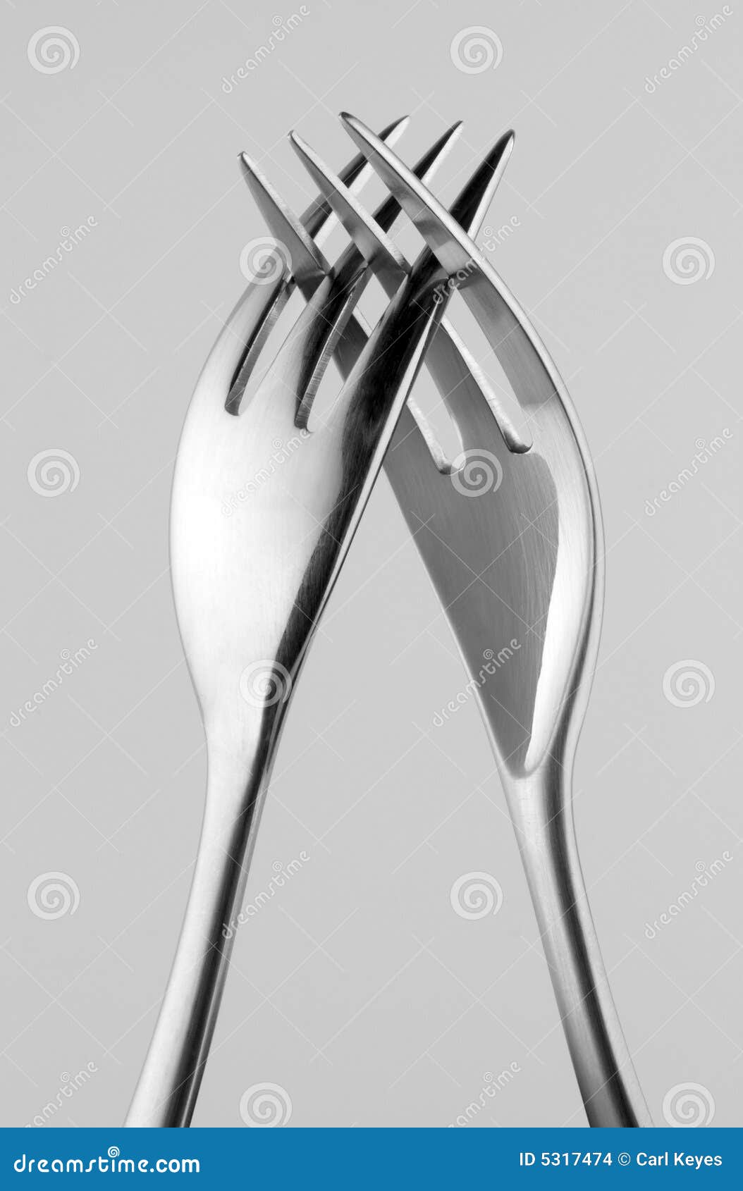Two Forks Intertwined on Gray Stock Photo - Image of objects, forks ...