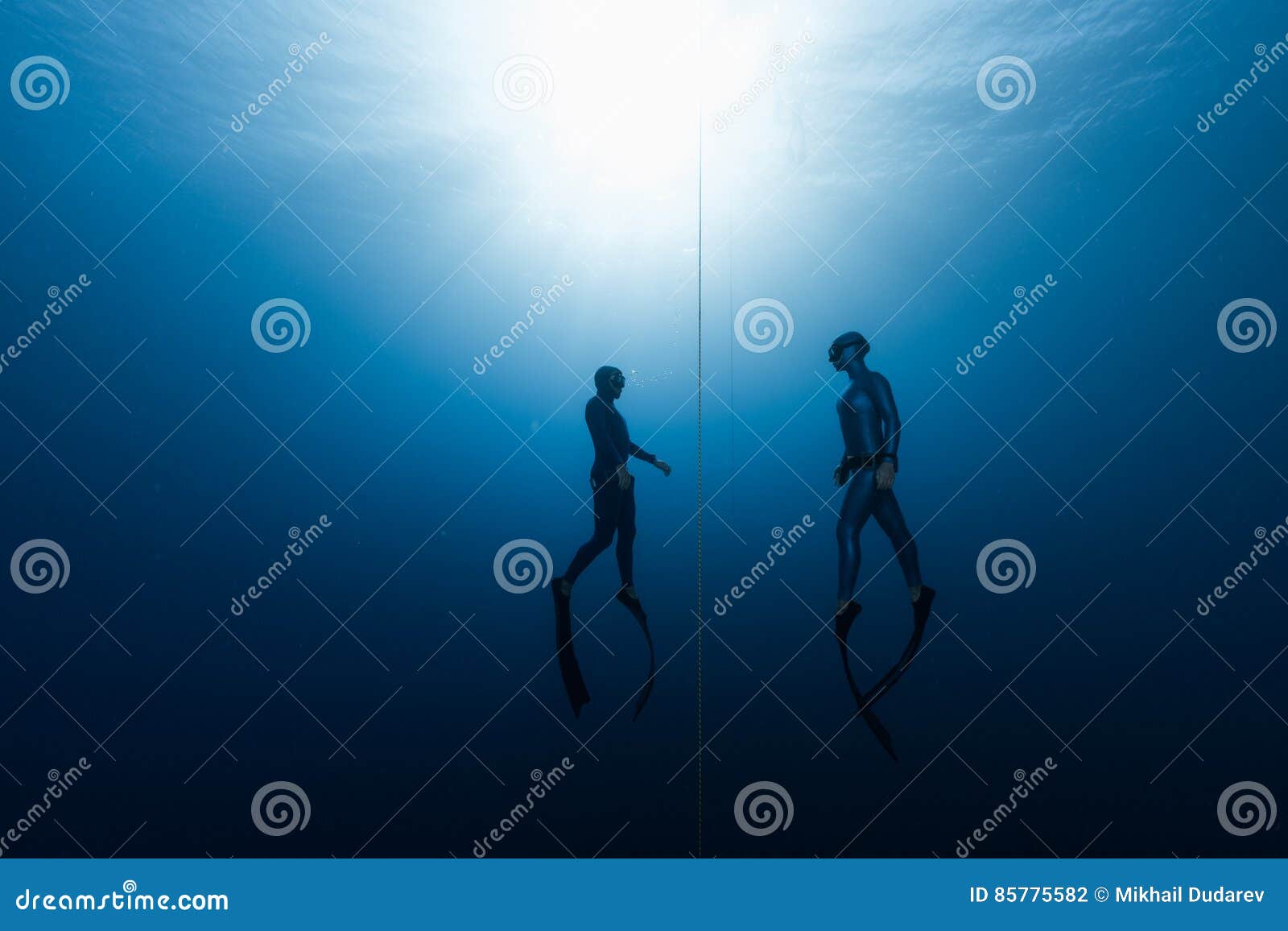 Two Free Divers Ascending from the Depth Stock Photo - Image of person ...