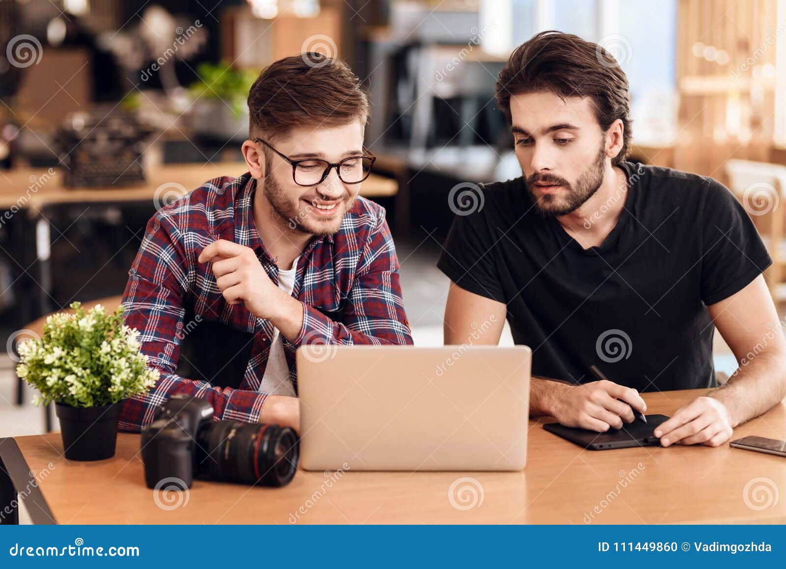 Two Freelancer Men Discussing at Laptop at Desk. Stock Photo - Image of ...