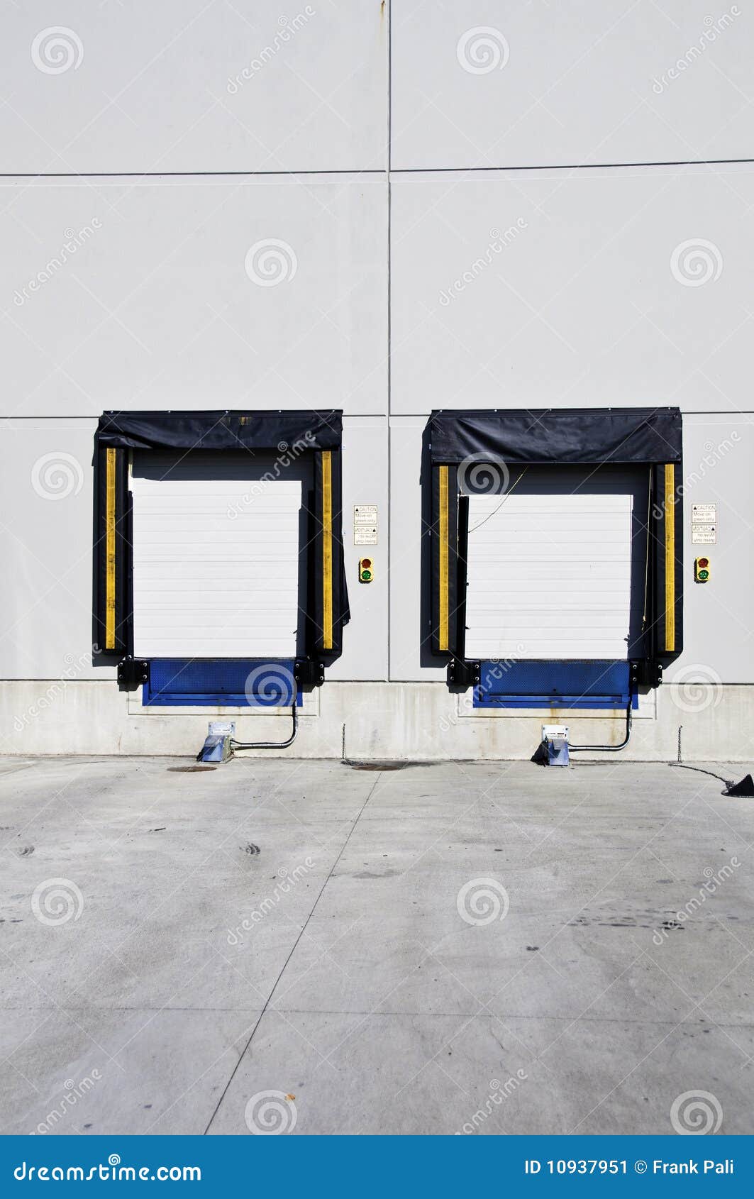 Two Freight Loading Doors with a Set of Lights Stock Image - Image of ...