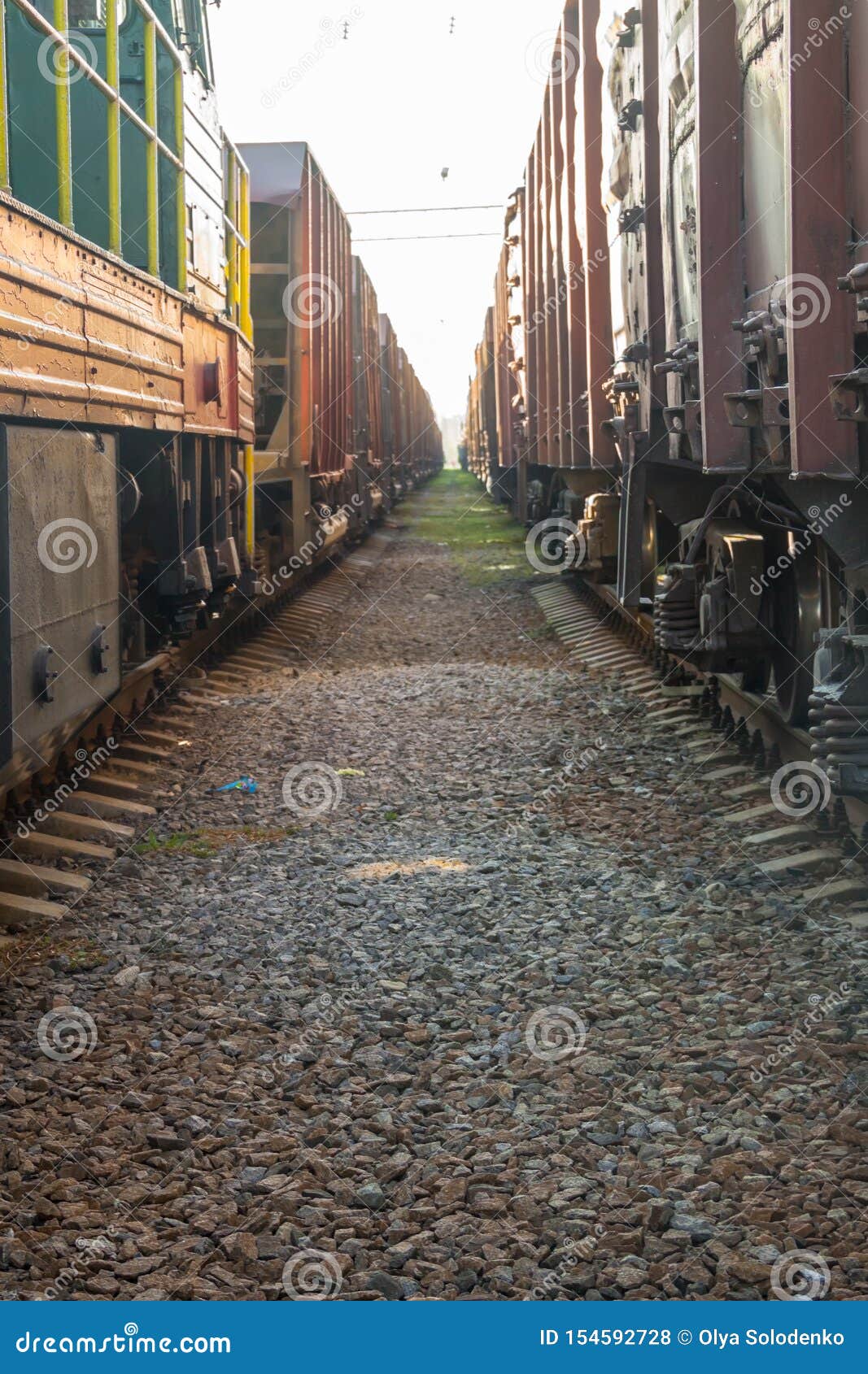 Between two freight trains stock photo. Image of road - 154592728