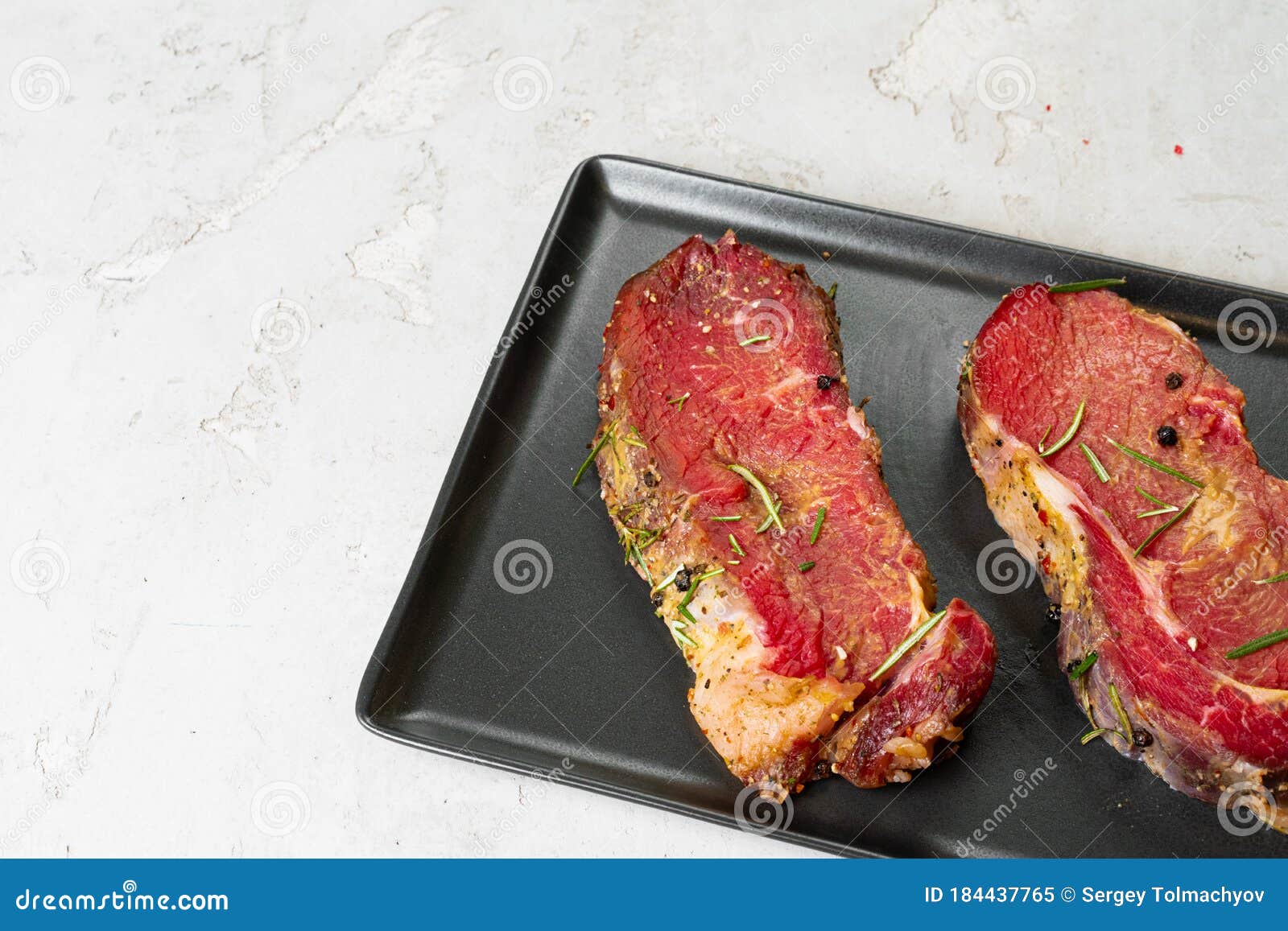 Two Fresh Raw Meat Steaks on Black Ceramic Plate Stock Image - Image of ...