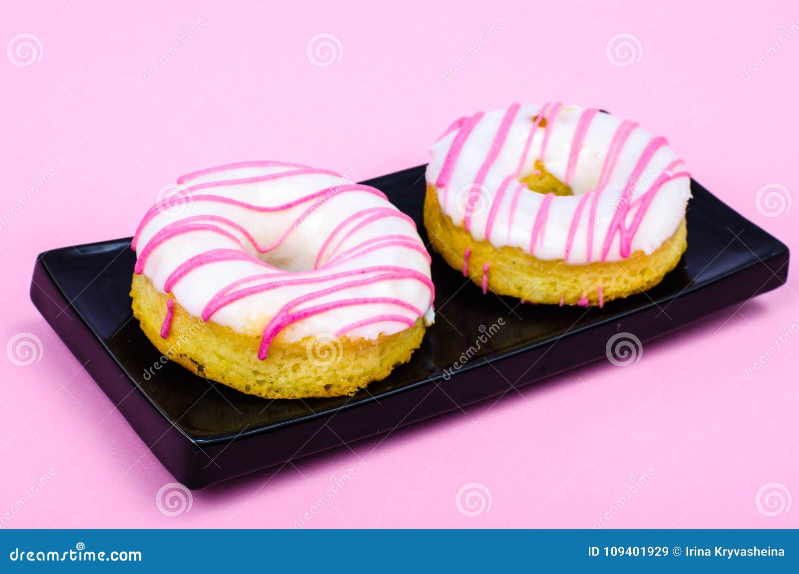 Two Fresh Round Donuts on Black Plate Stock Image - Image of fried ...