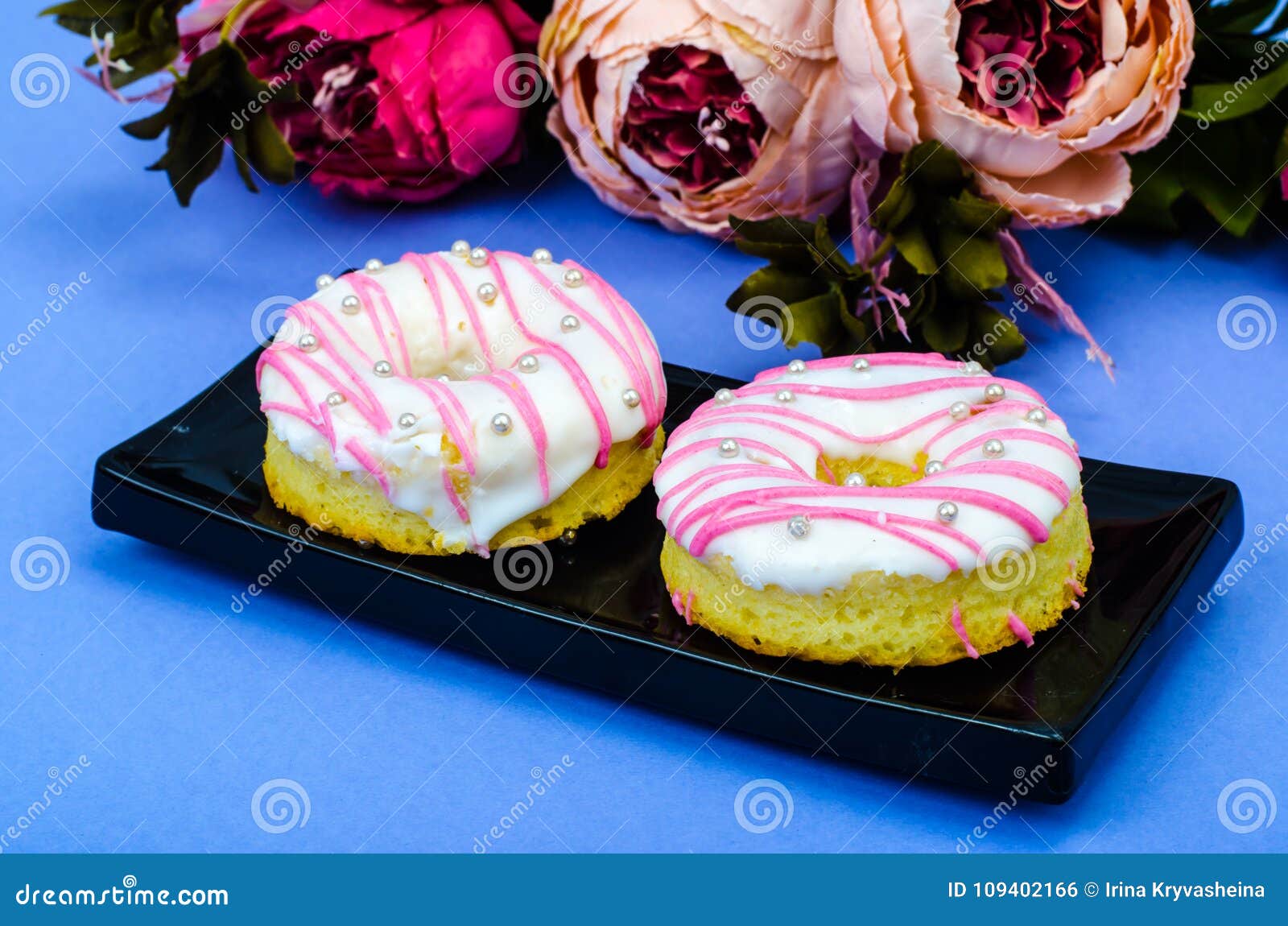 Two Fresh Round Donuts on Black Plate Stock Photo - Image of cake ...