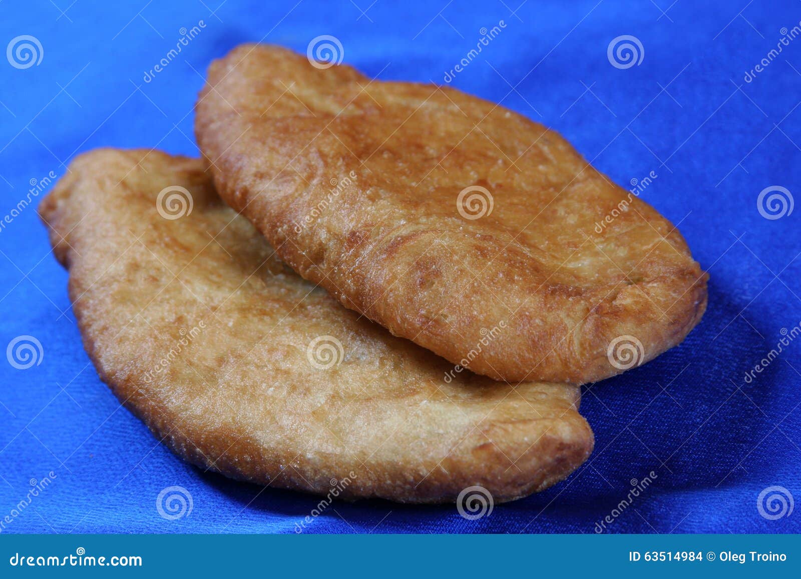 Two Fried Cake on a Blue Background Stock Photo - Image of food, cake ...