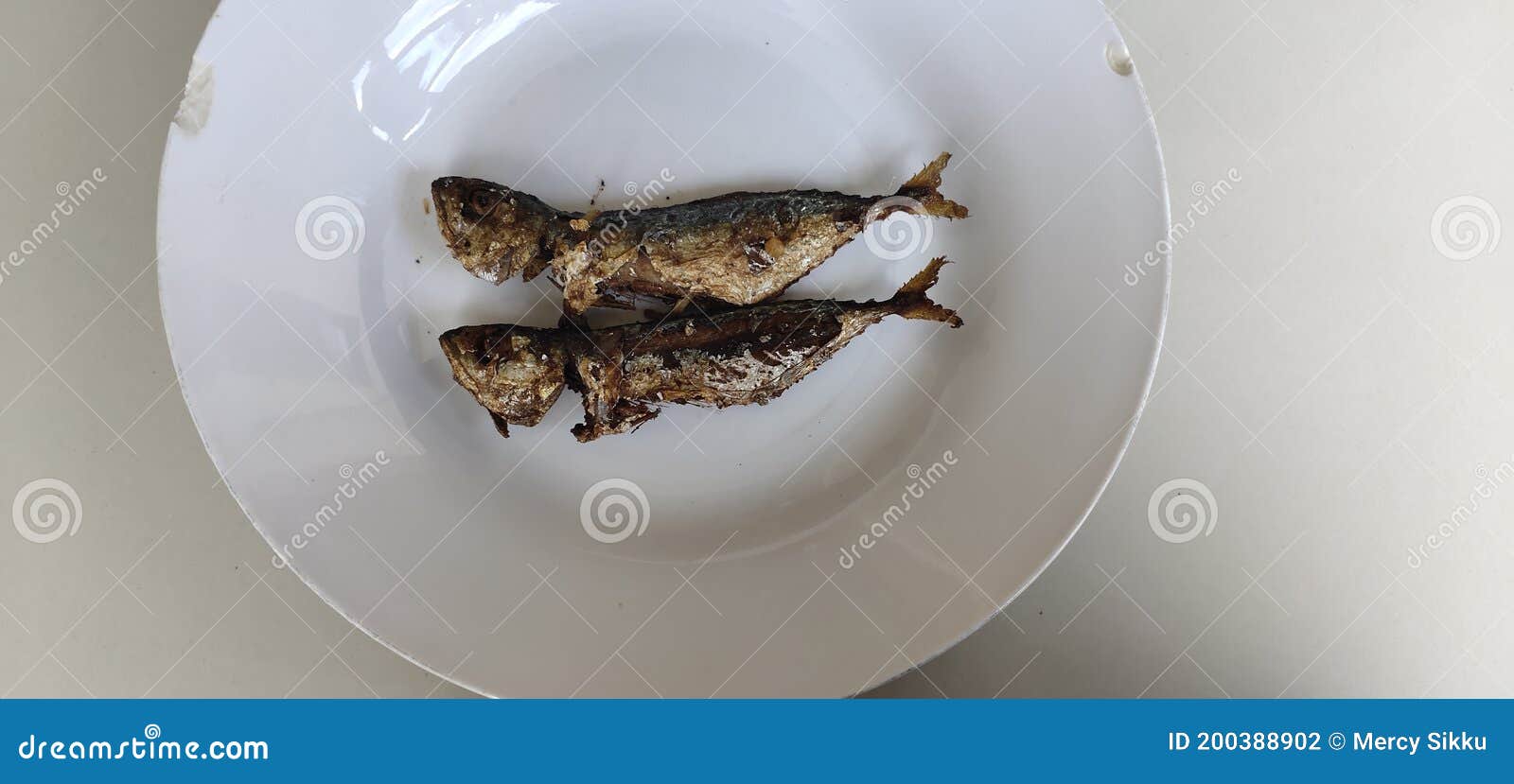 Two Fried Fish Ready To Eat Stock Photo - Image of vegetable ...