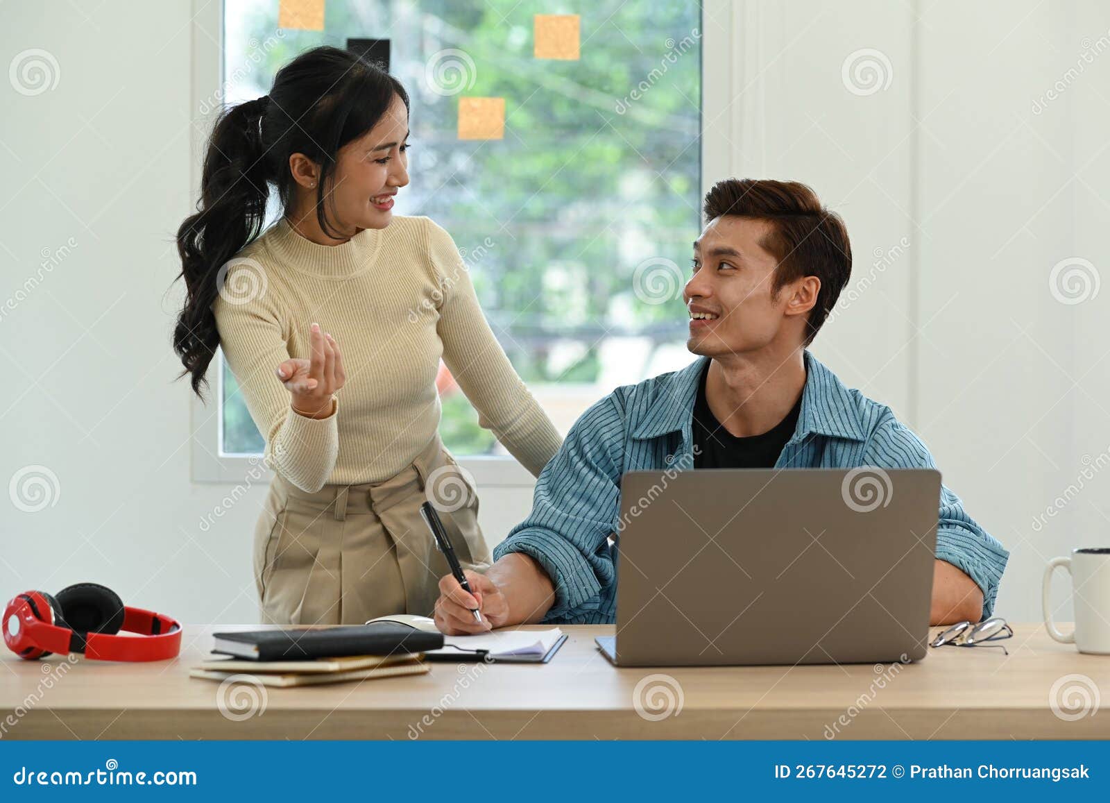 Two Friendly Coworkers Sharing Ideas, Discussing Project Plan Together ...