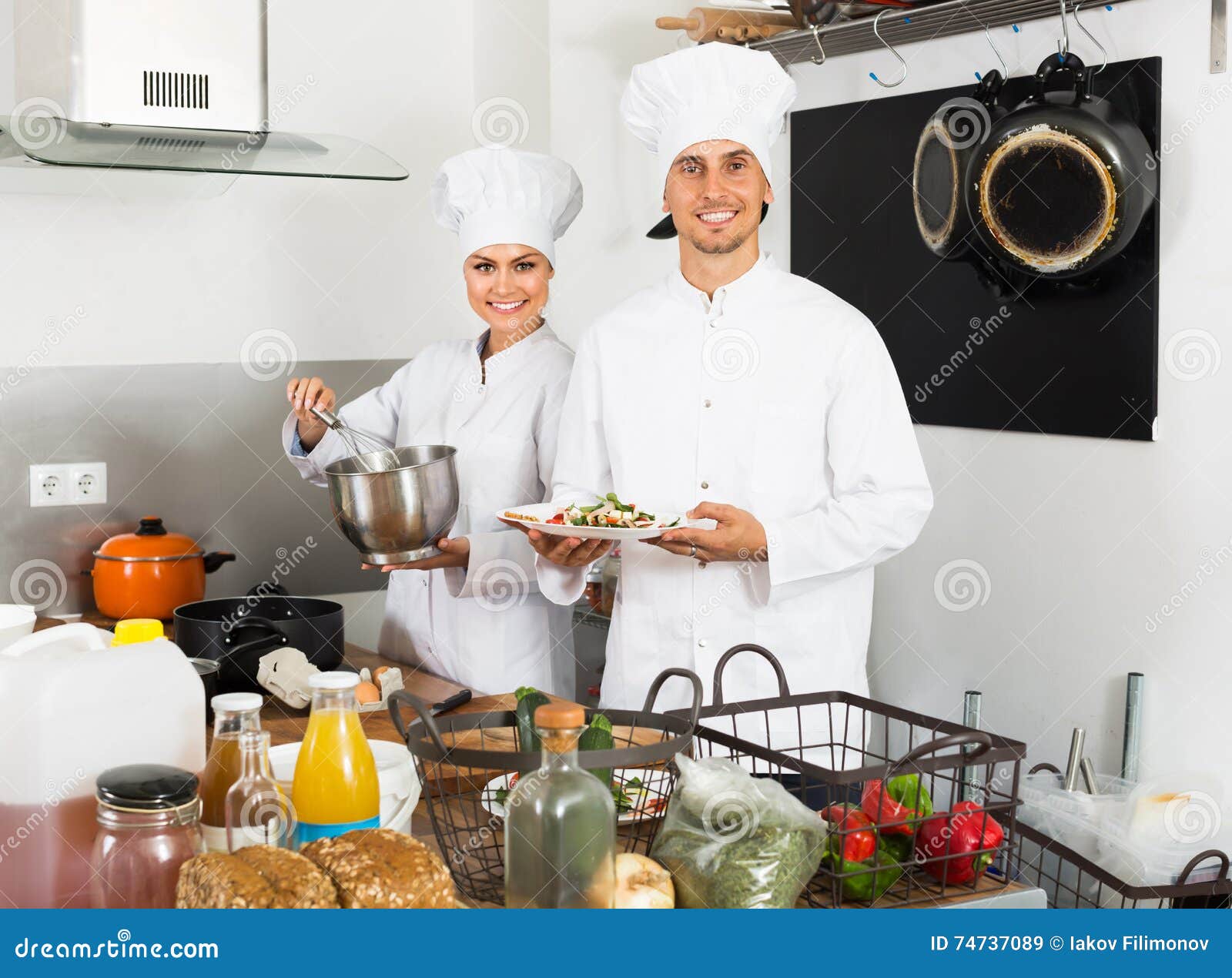Two Friendly Female and Male Cooks Stock Image - Image of casserole ...
