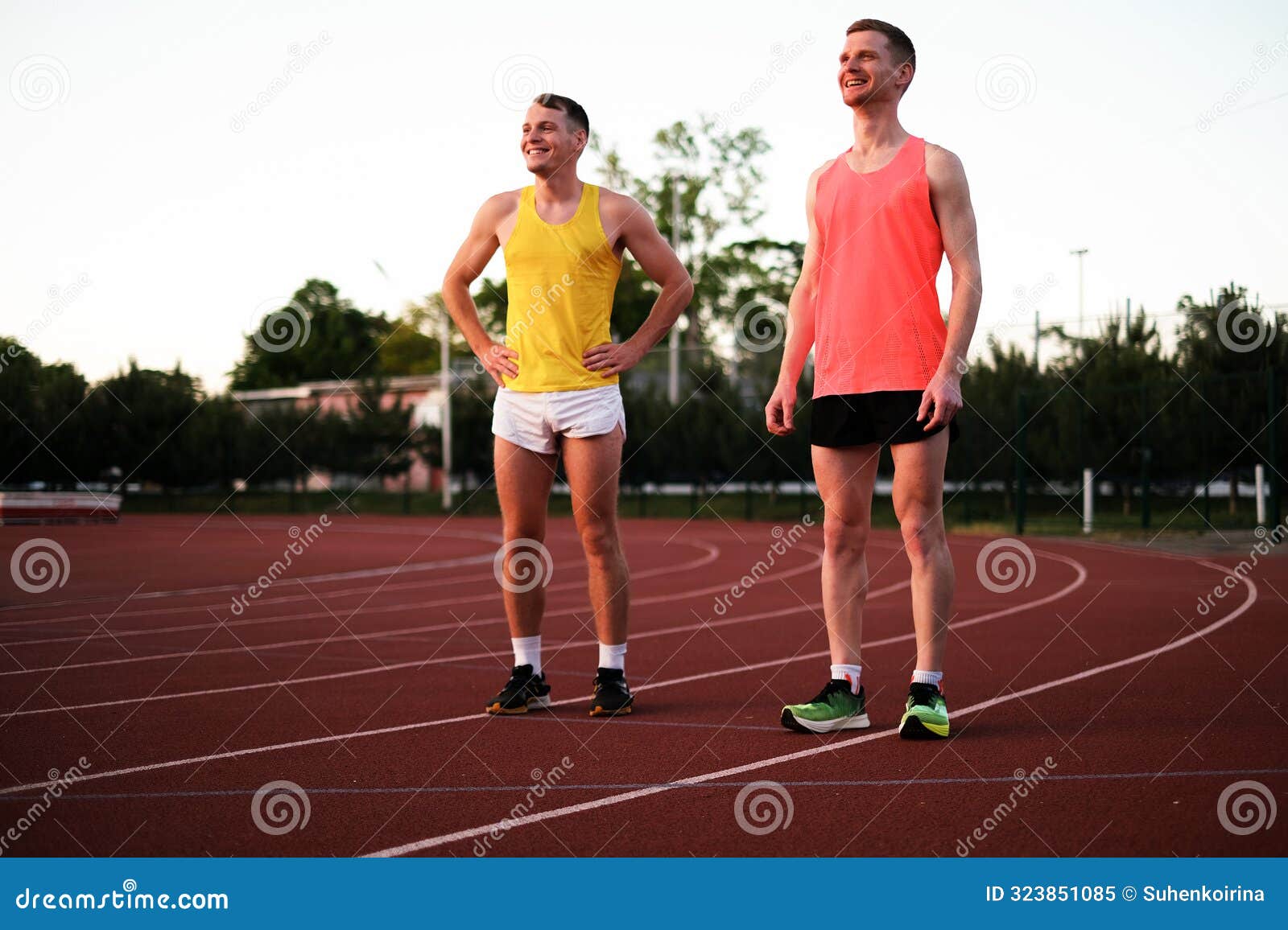 Two Athletes Stand in the Stadium after Training Stock Image - Image of ...