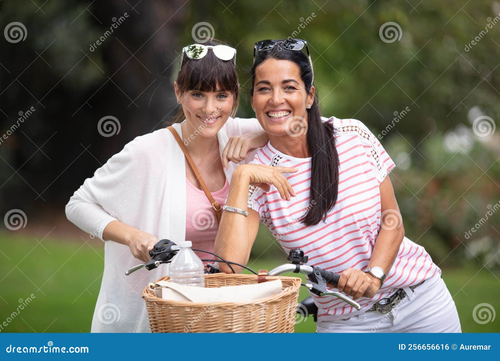 Two Friends on Bikes Outdoors Smiling Stock Photo - Image of bicycle ...