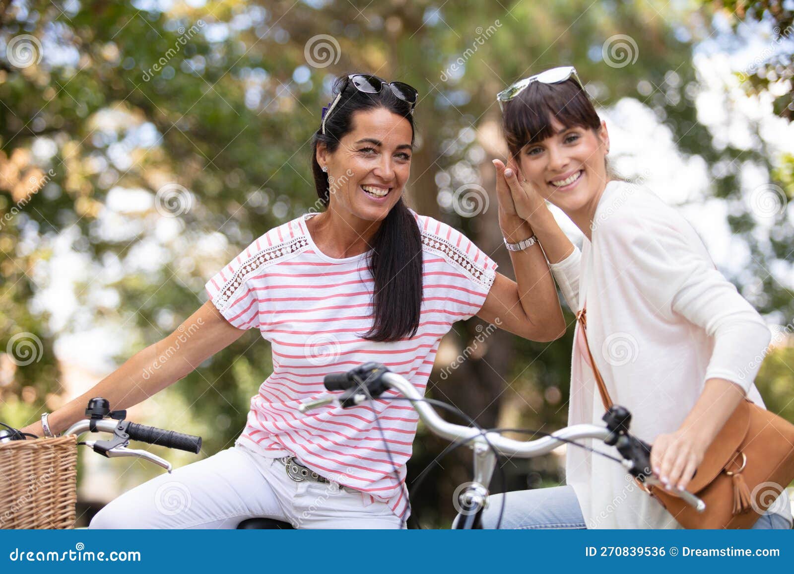 Two Friends on Bikes Outdoors Smiling Stock Photo - Image of cycle ...