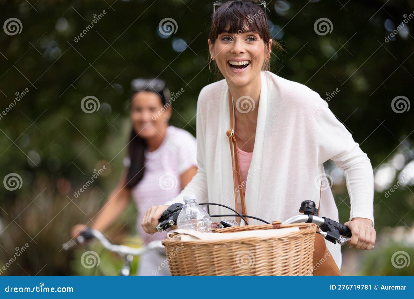 Two Friends on Bikes Outdoors Smiling Stock Image - Image of latin ...