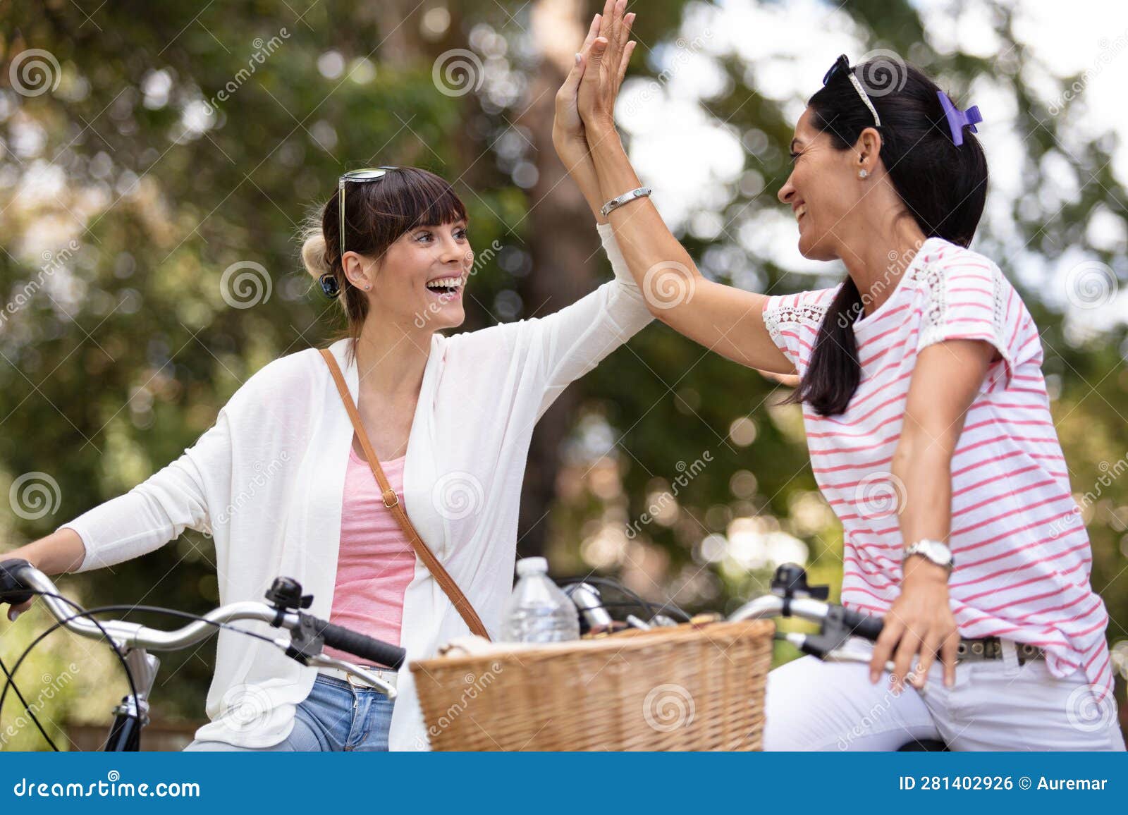 Two Friends on Bikes Outdoors Smiling Stock Photo - Image of friendship ...