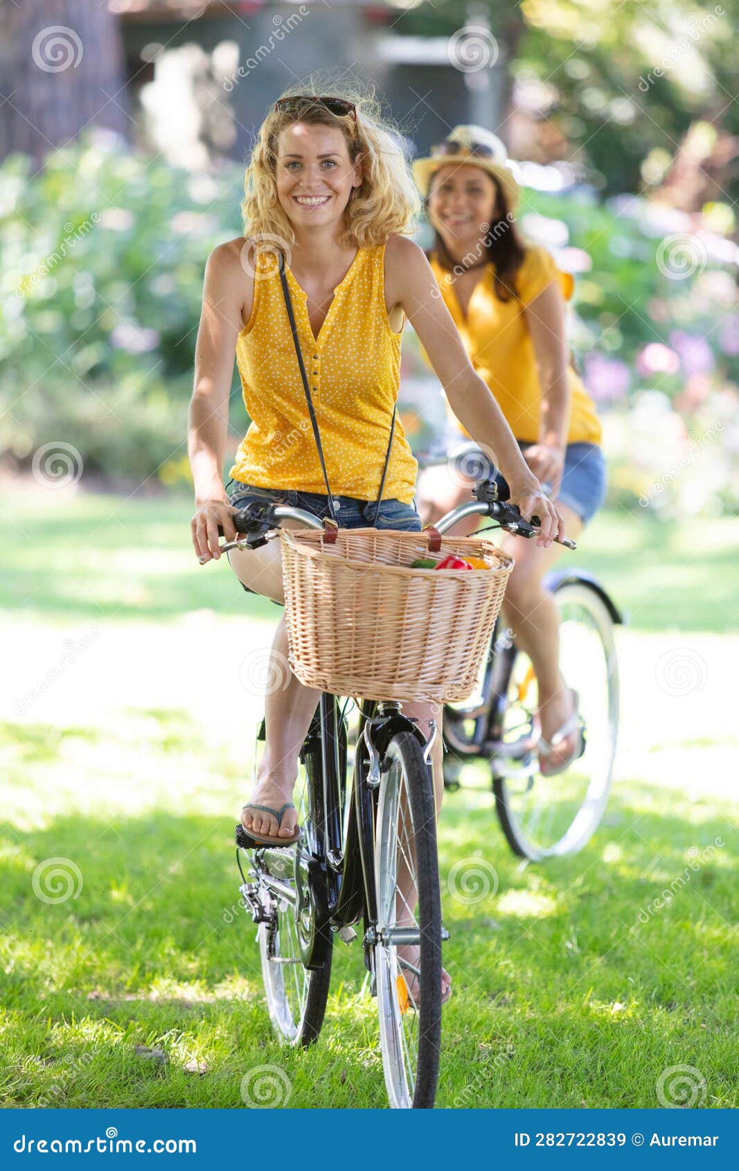 Two Friends on Bikes Outdoors Smiling Stock Image - Image of friendship ...
