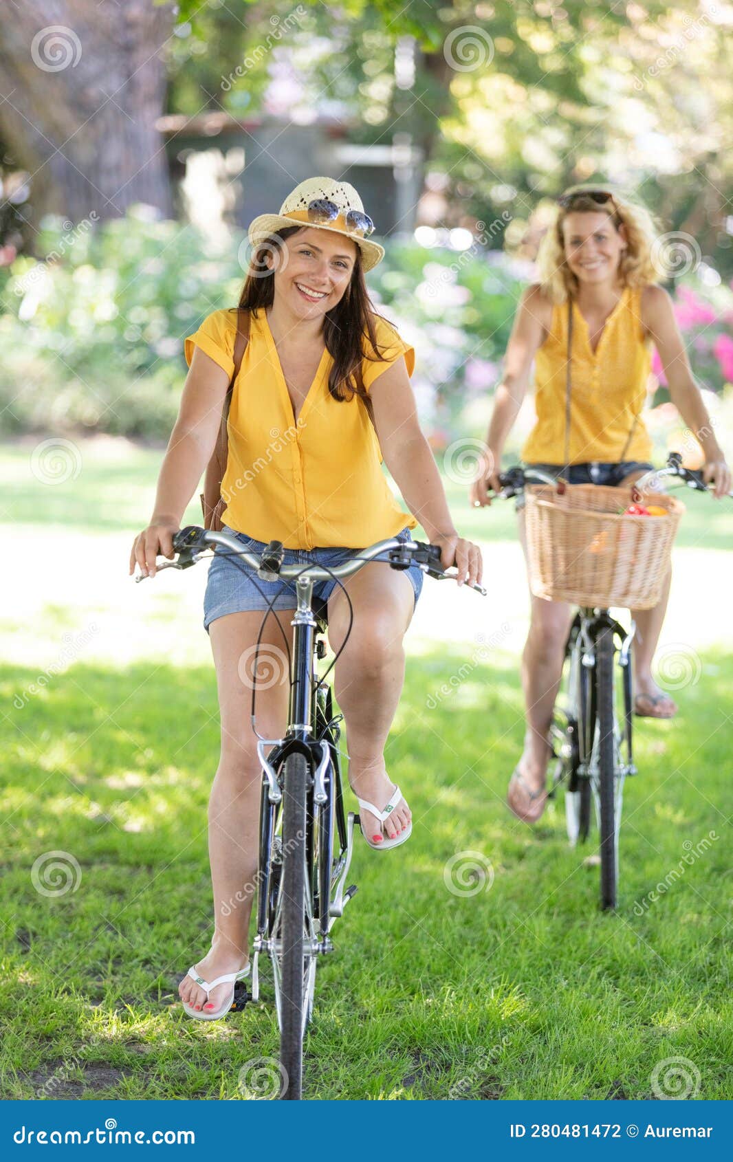 Two Friends on Bikes Outdoors Smiling Stock Photo - Image of mature ...
