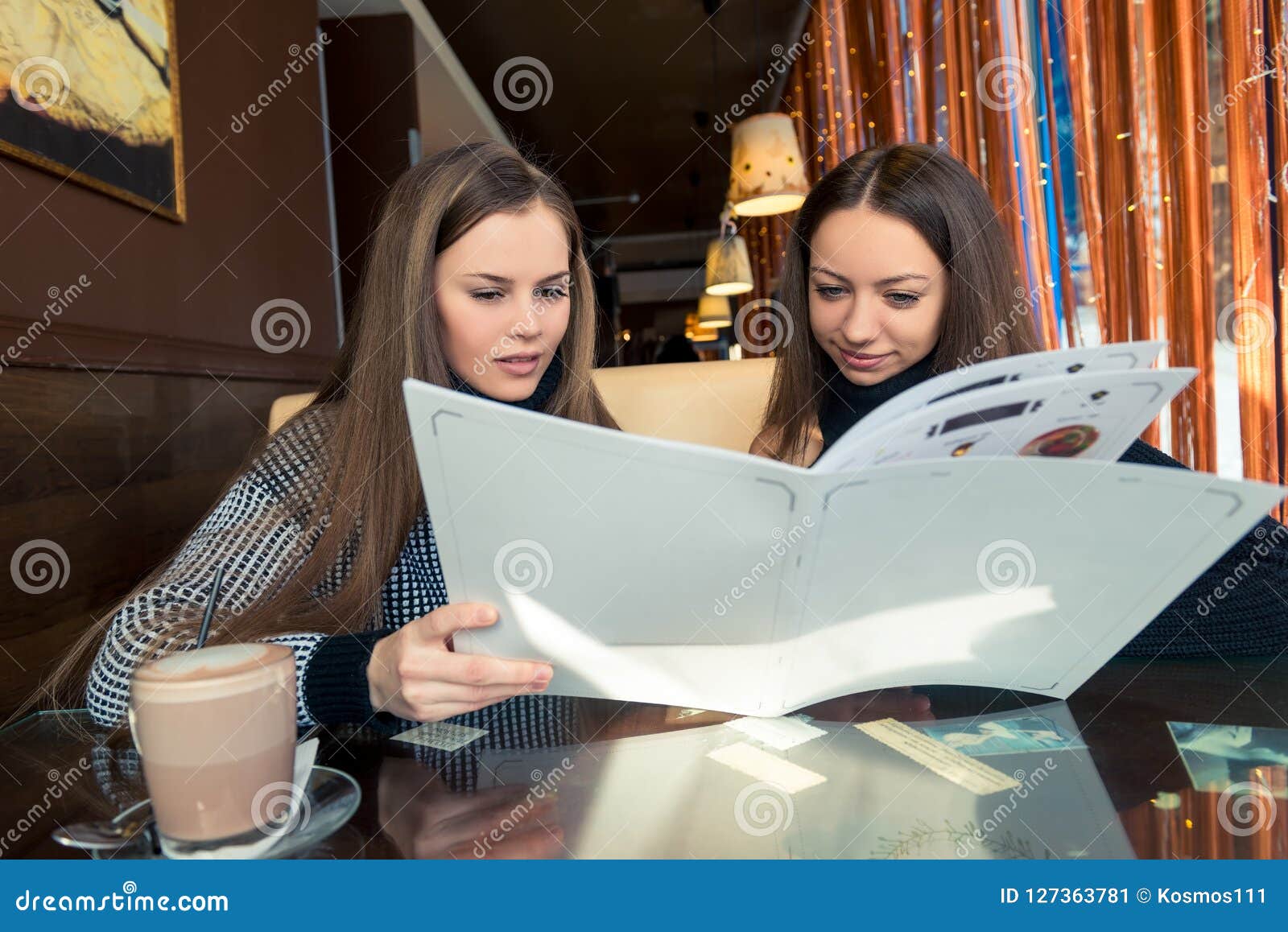 Two Friends in a Cafe at the Table Stock Image - Image of choose ...
