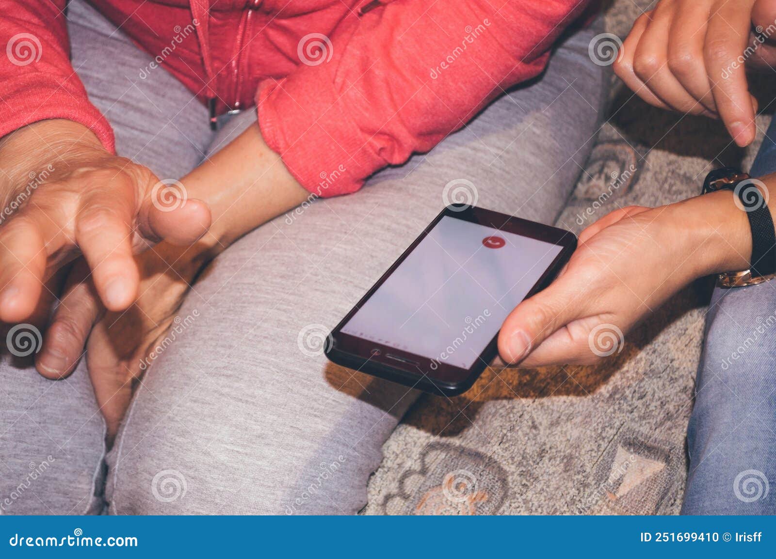 Two Friends Communicate, Holding Smartphone in Hands Stock Photo ...