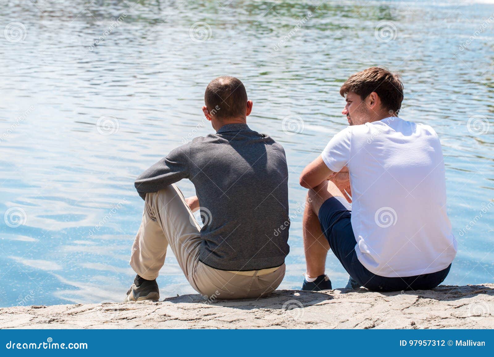 Two Friends Communicate by the River Stock Photo - Image of male ...