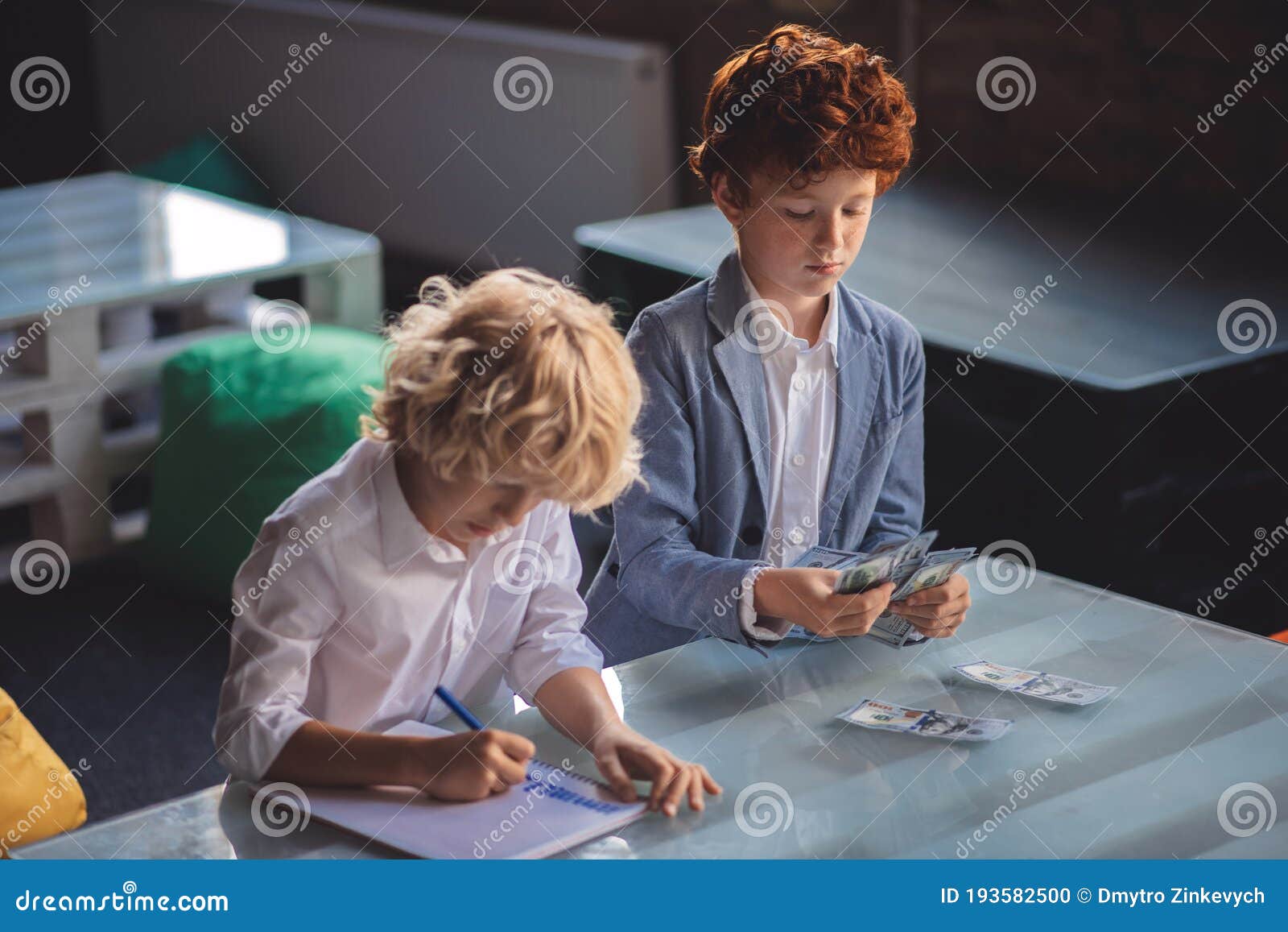 Two Friends Counting Saved Money and Looking Involved Stock Photo ...