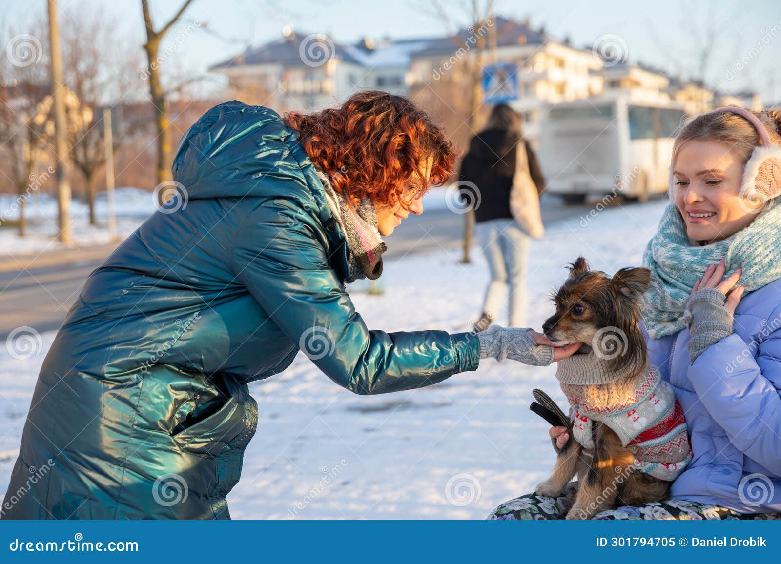 Two Friends and a Dog Wait for the Bus while Sitting at the Bus Stop ...