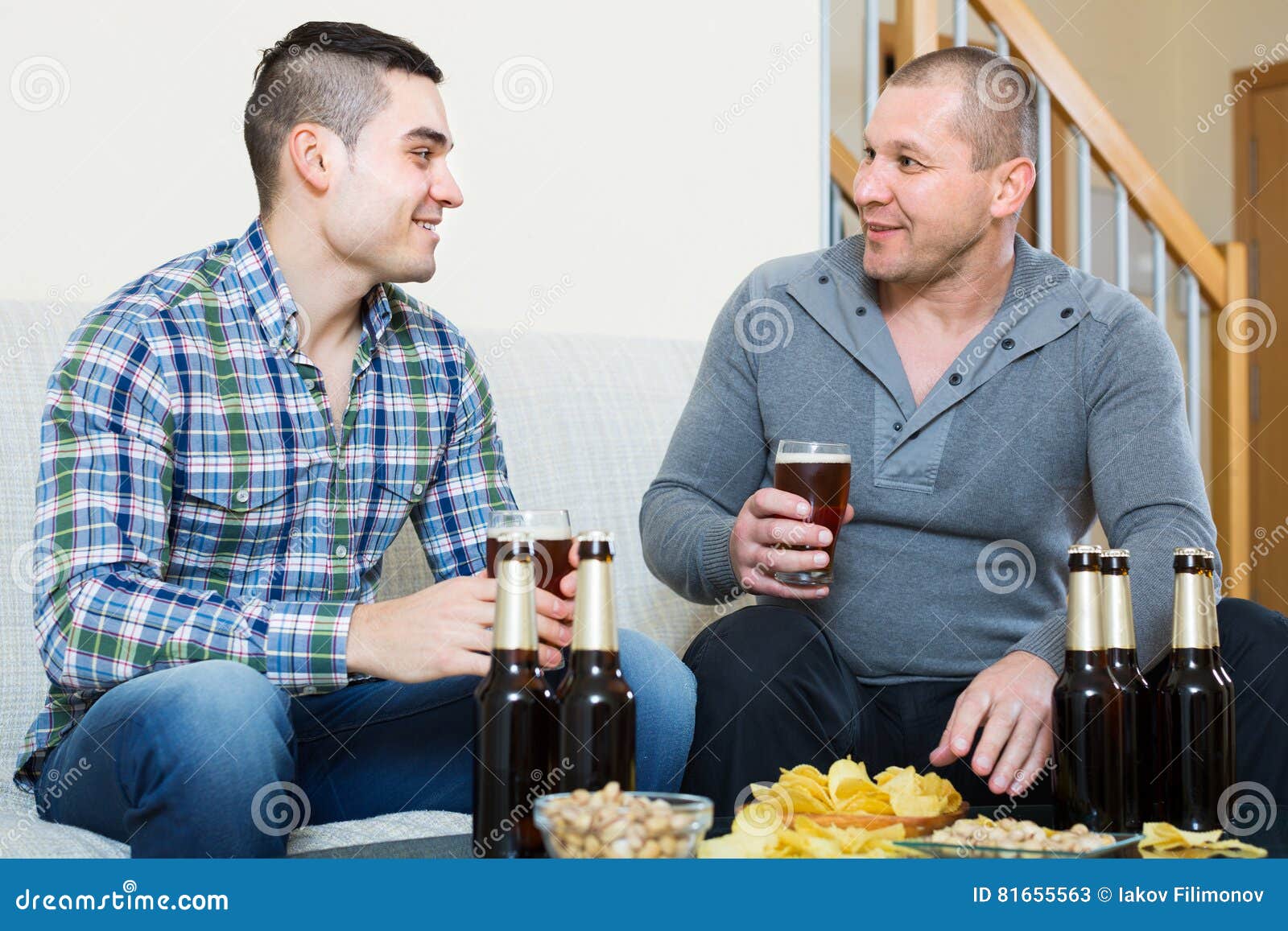 Two Friends Drinking Beer at Home Stock Image - Image of lifestyle ...