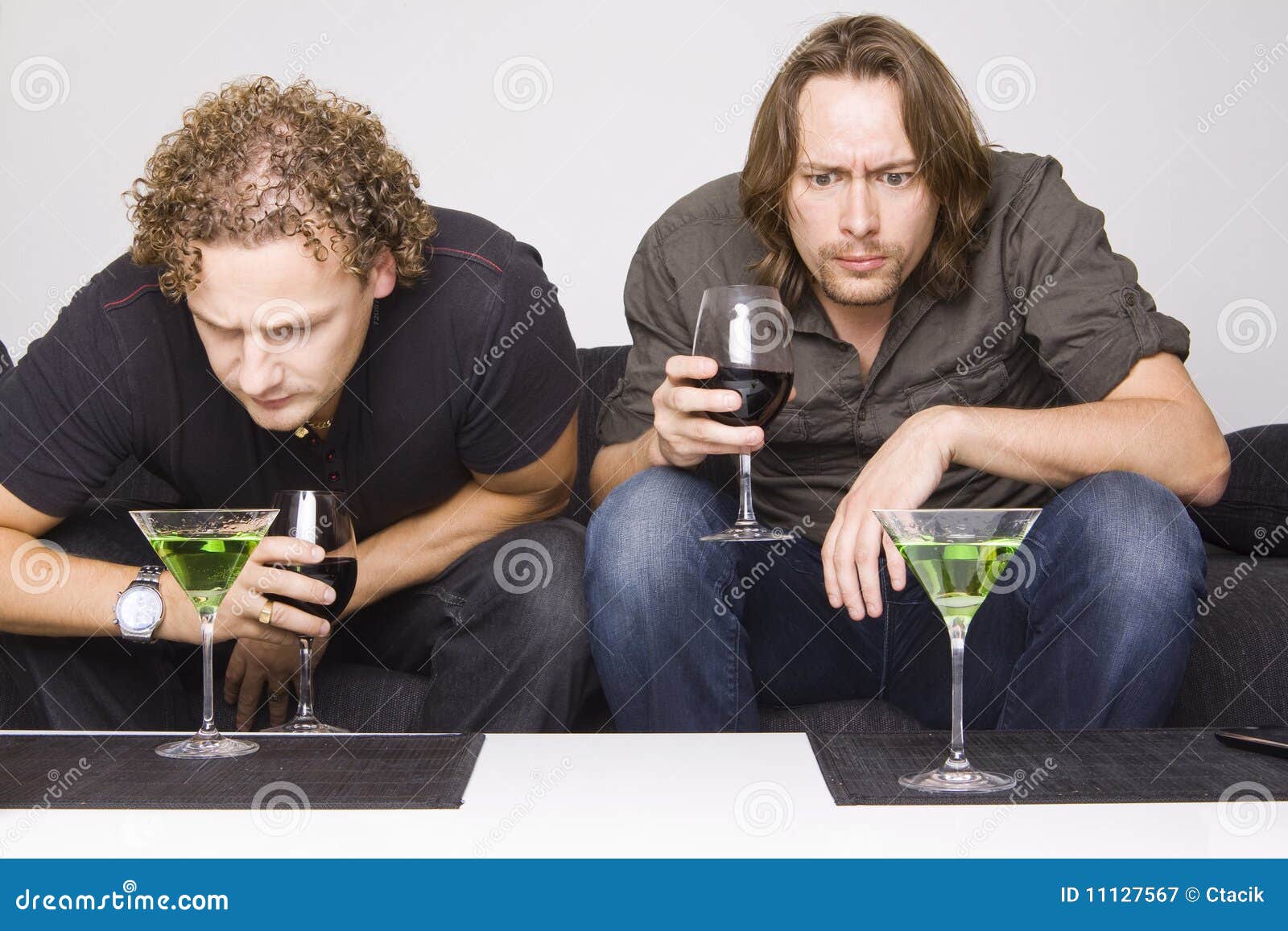 Two Friends Drinking at Home Stock Image - Image of grimacing, adult ...