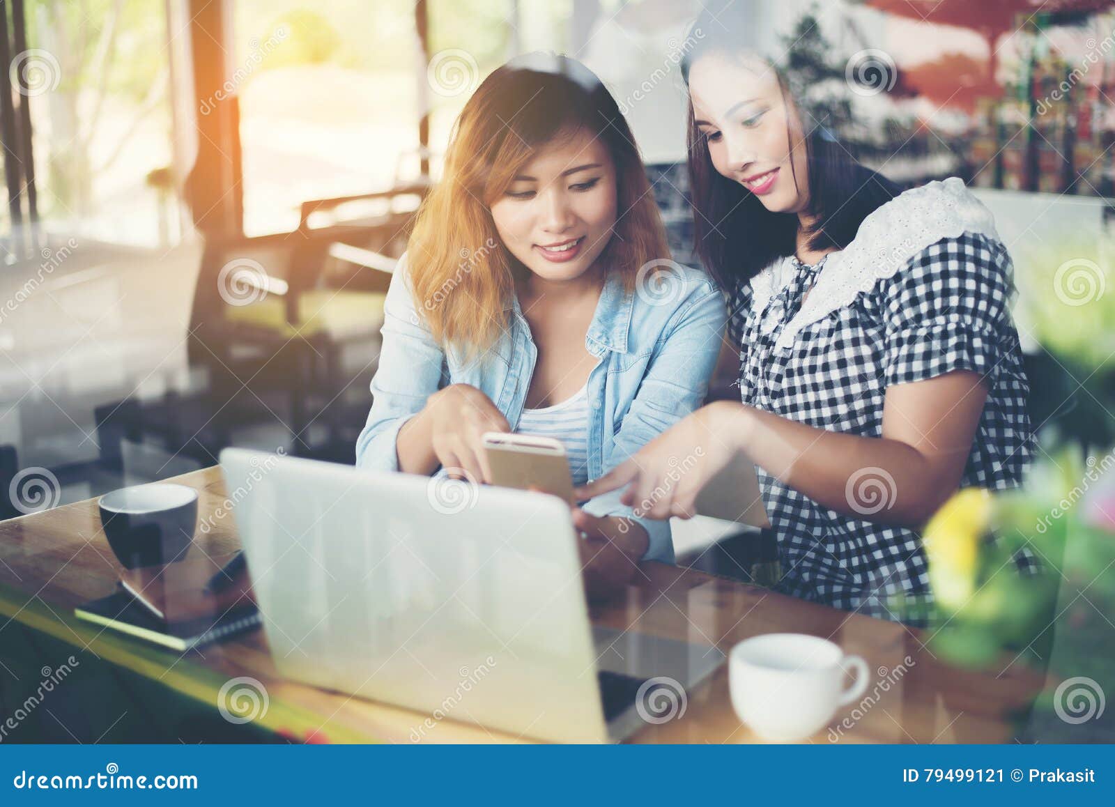 Two Friends Enjoying Working Together with Window Reflection in Stock ...