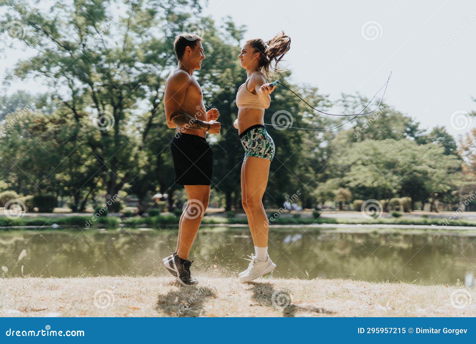 Active Caucasian Couple Exercising Outdoors: Friends Jumping Rope in ...