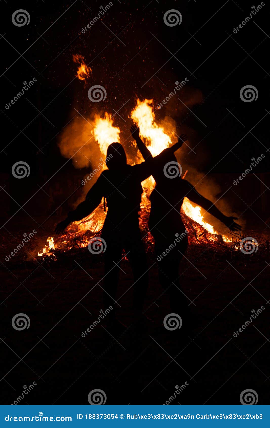 Two Friends in Front of a Giant Fire Stock Photo - Image of copy ...