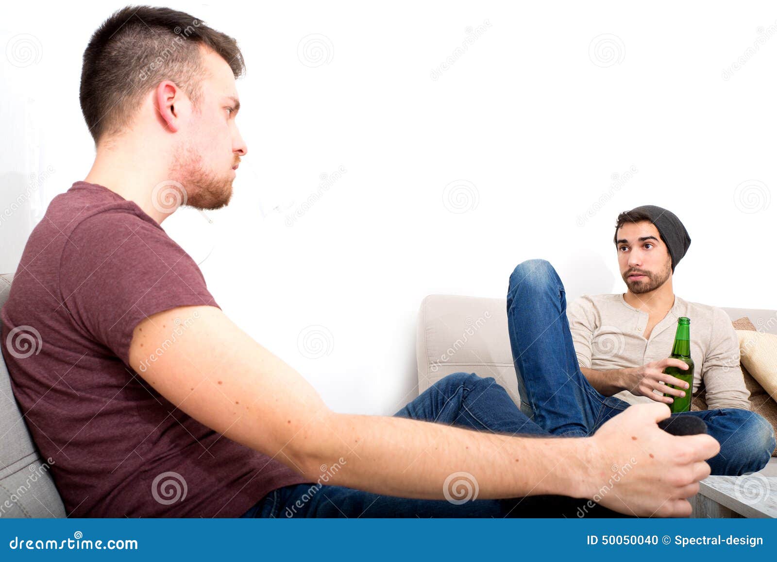 Two Friends Having a Conversation in the Living Room Stock Photo ...