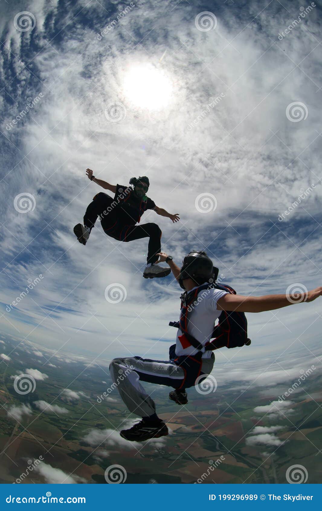 Two Friends Having Fun in Freefall. Against the Sun Stock Image - Image ...