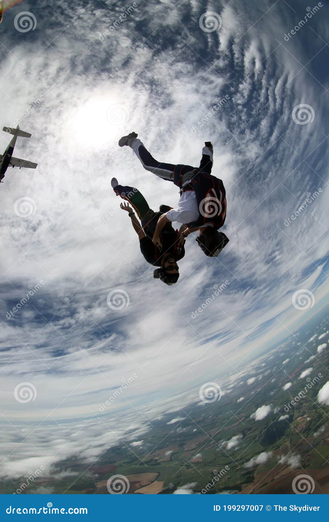 Two Friends Having Fun in Freefall. Against the Sun Stock Image - Image ...