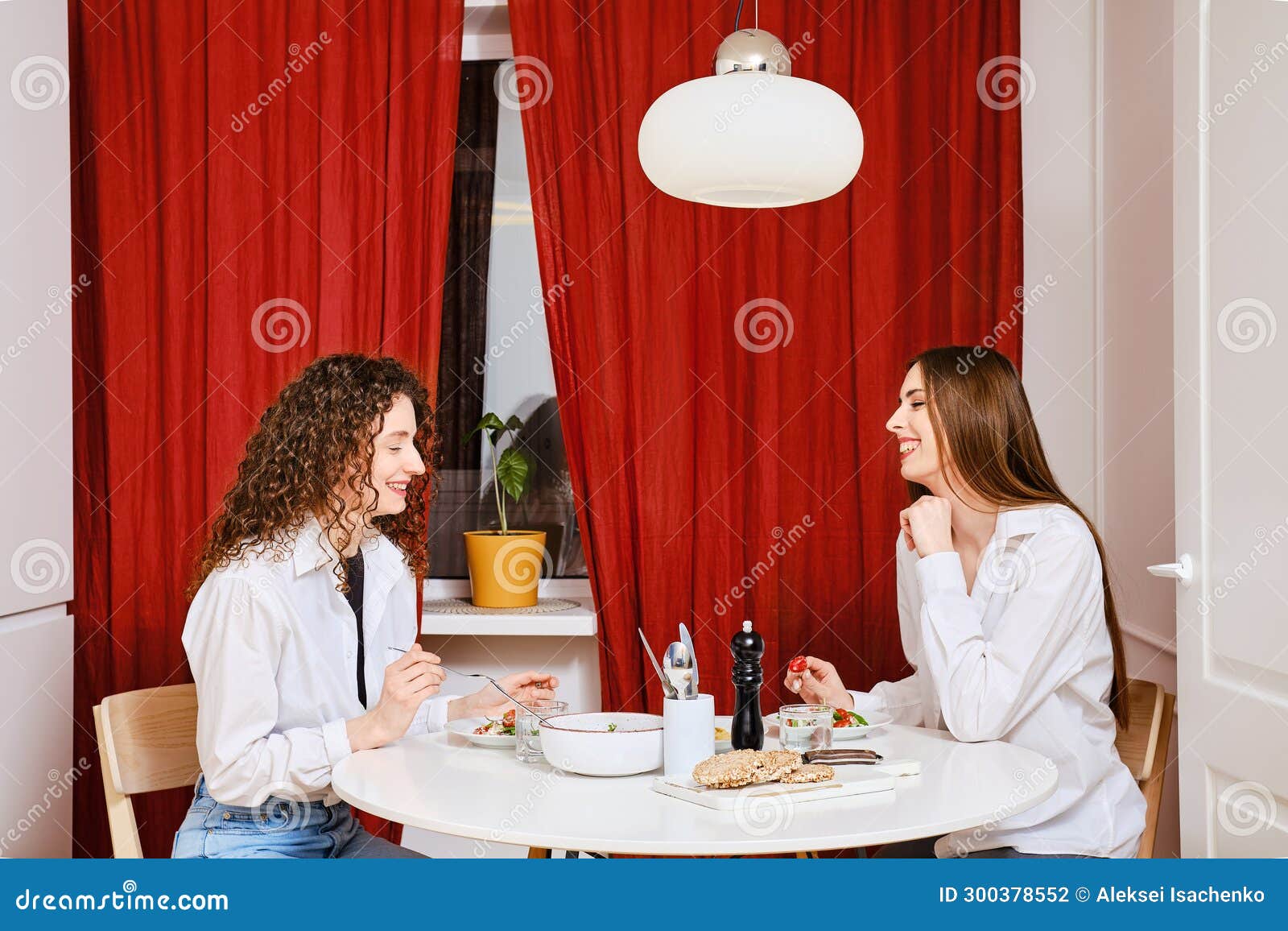 Two Friends Having Meal Together and Chatting Stock Photo - Image of ...