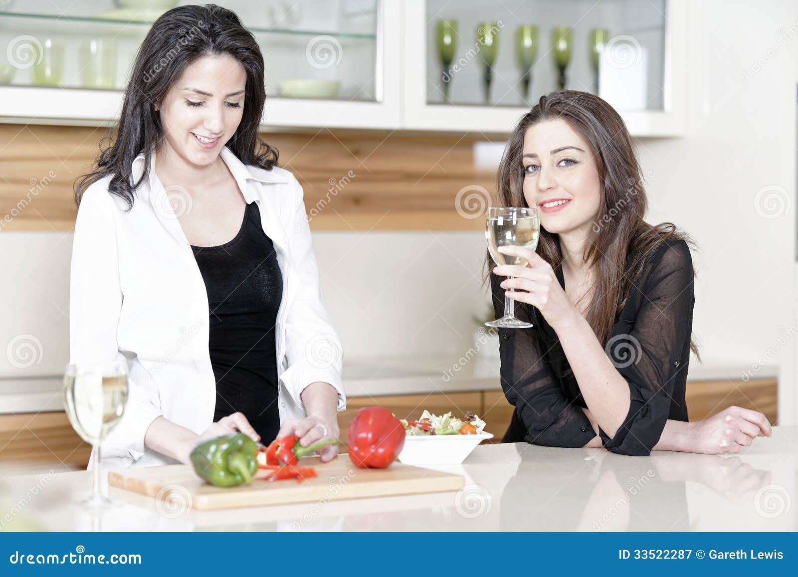 Two Friends in a Kitchen Cooking Stock Image - Image of dinner, glass ...