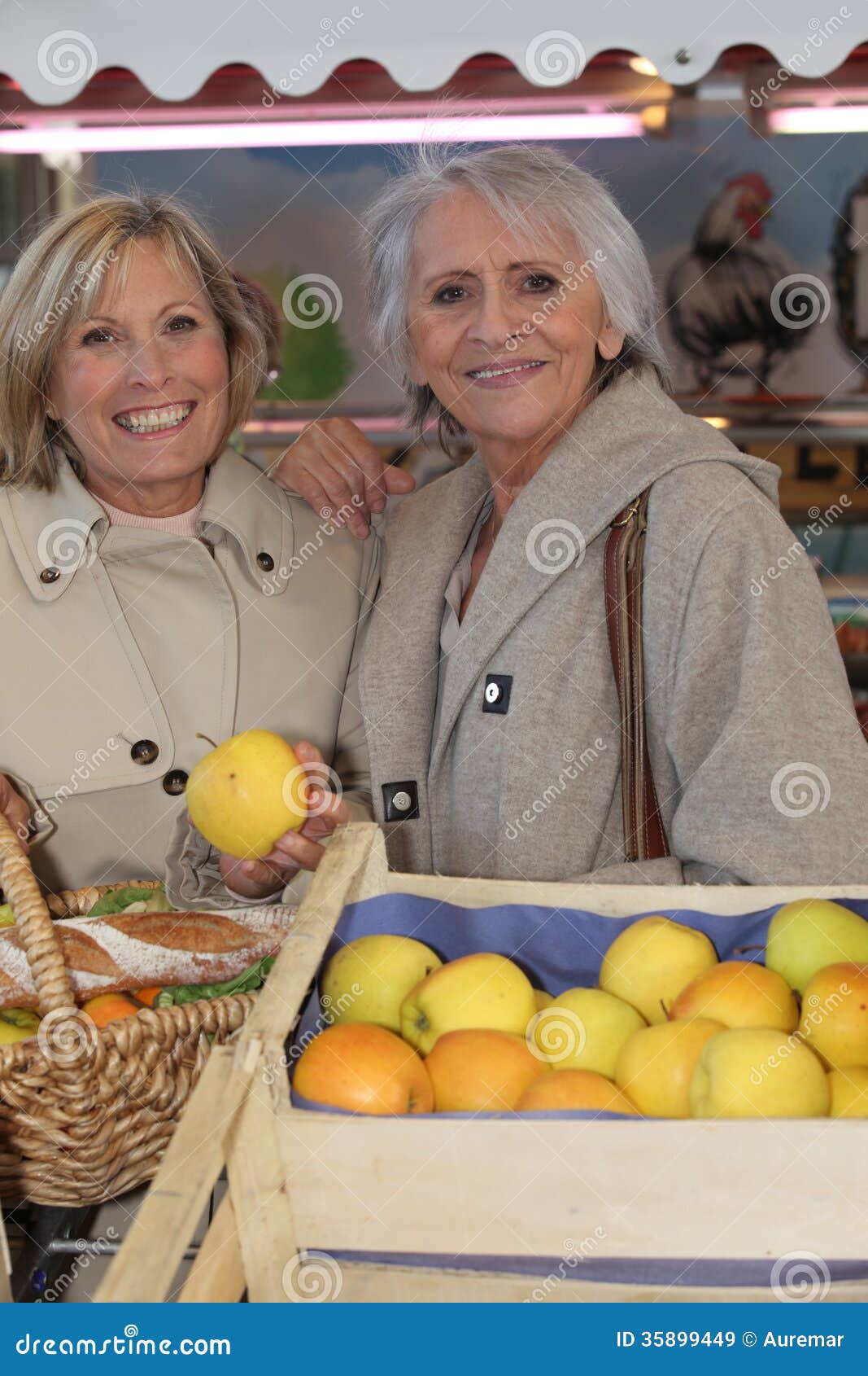 Two friends at market stock image. Image of apples, cold - 35899449